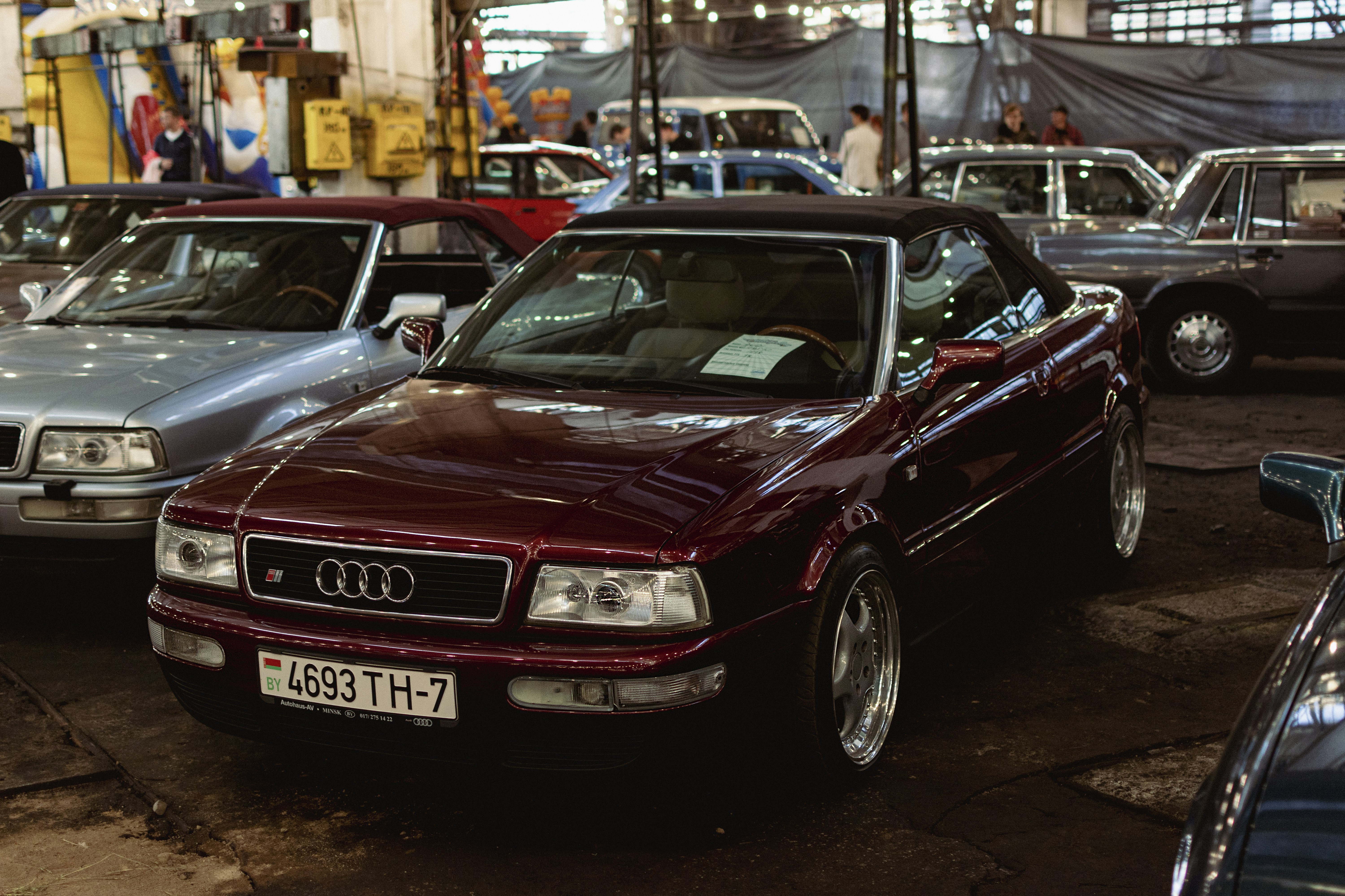 A red car parked in a parking lot photo – Free Car photography Image on ...
