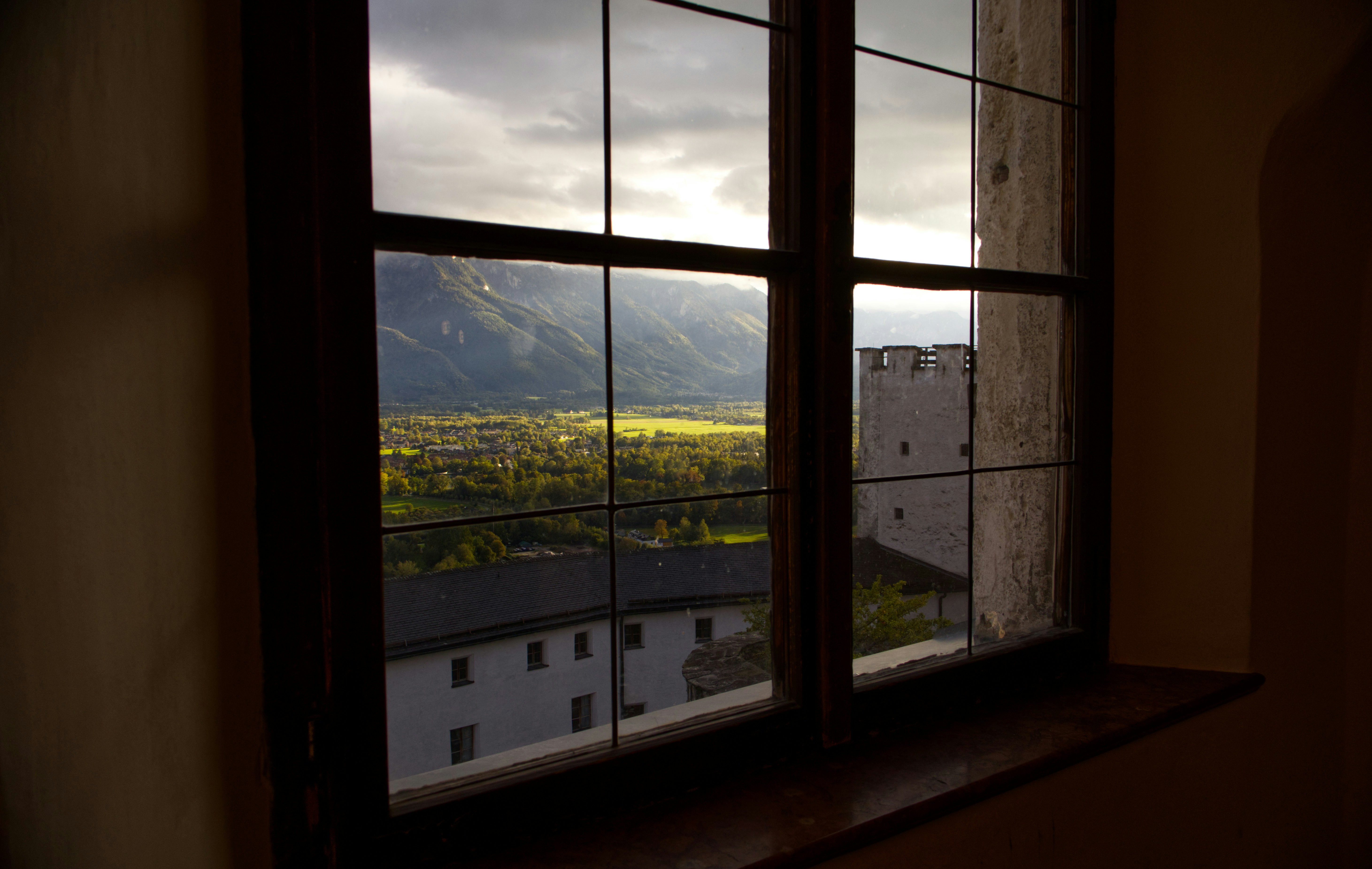 A window with a view of a city and mountains photo – Free Picture ...