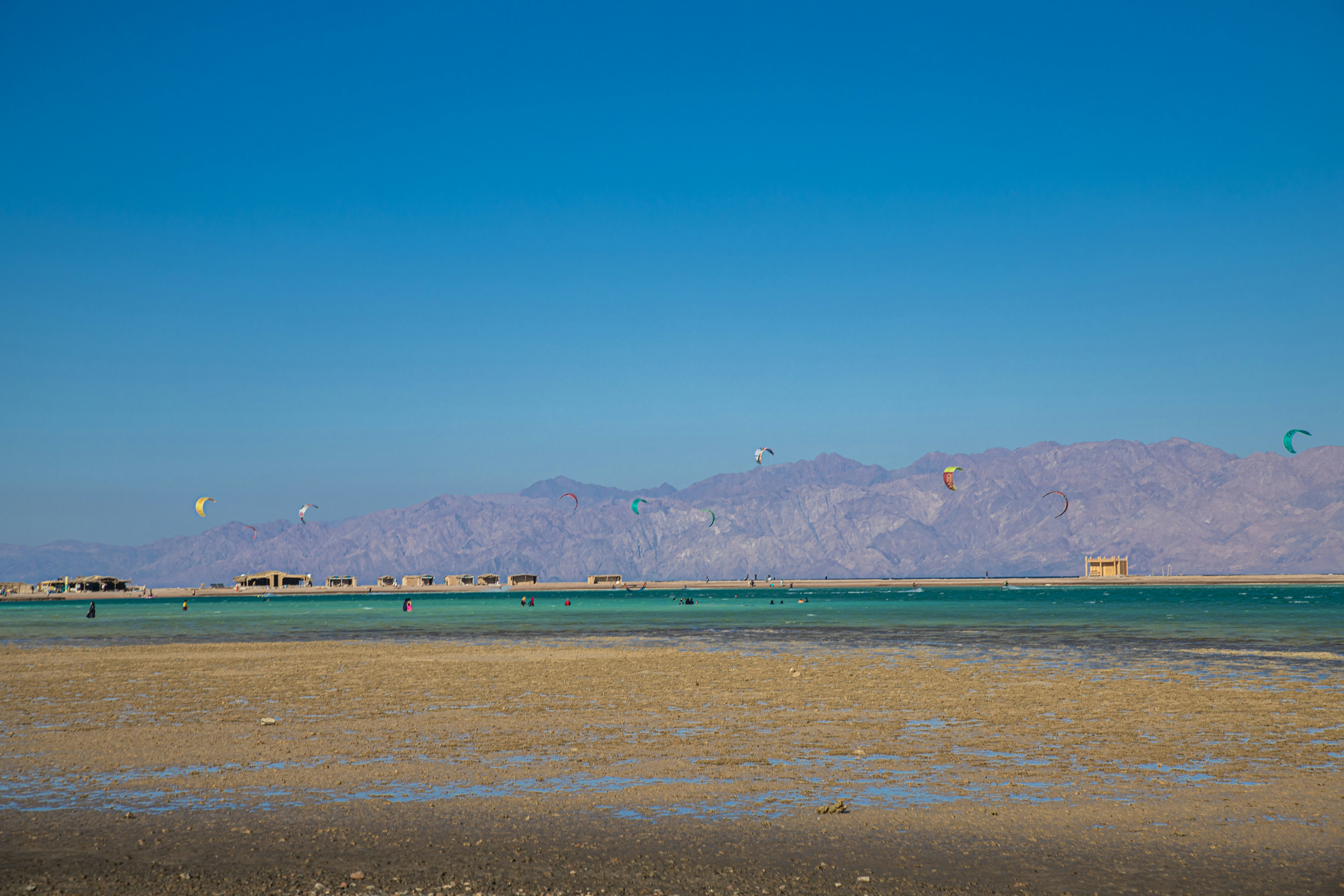 Sea Breeze Over Deserted Shore Near Distant Range