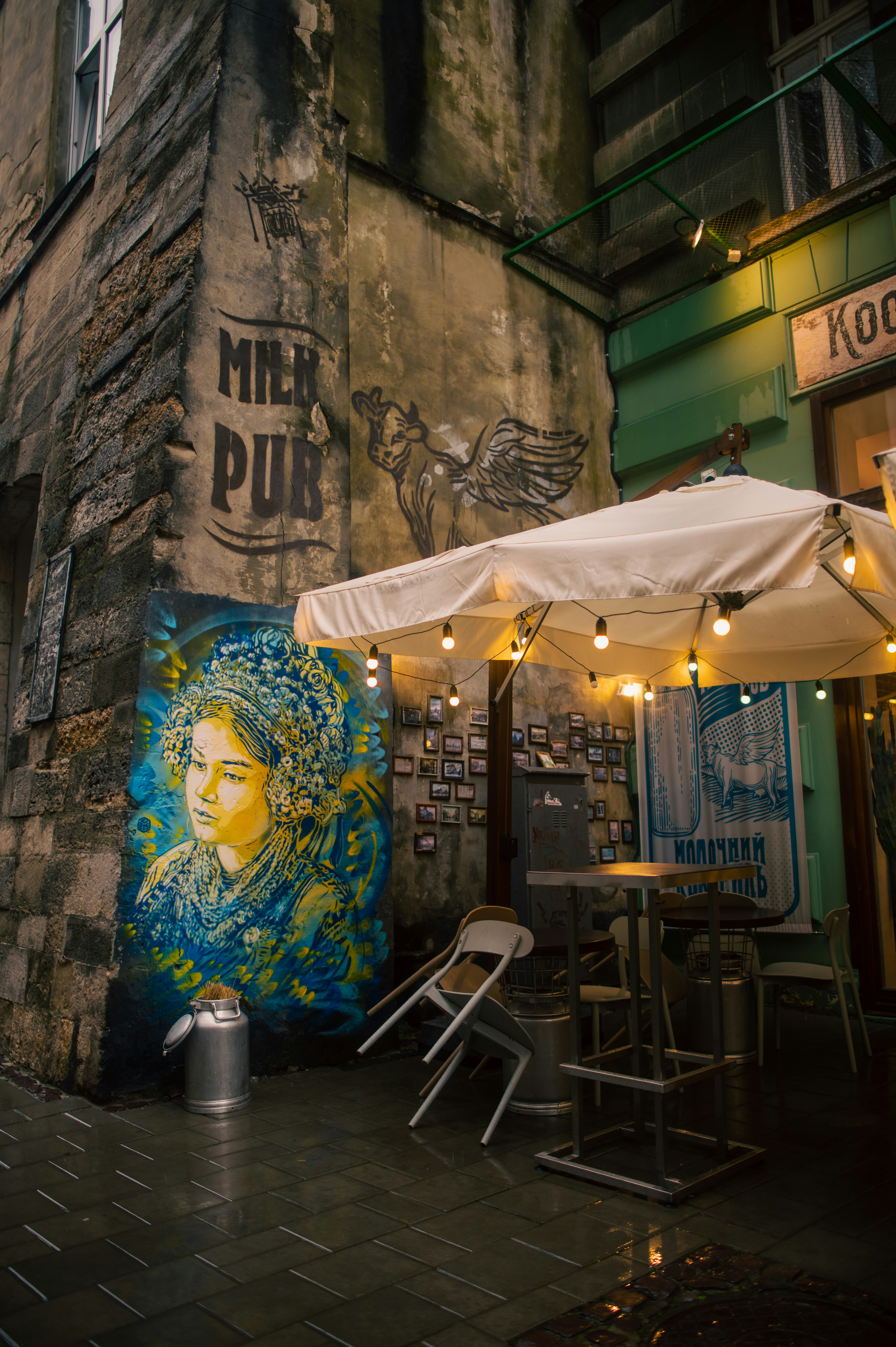 Cobalt-Hued Portrait Amid Lanterns at an Open-Air Café