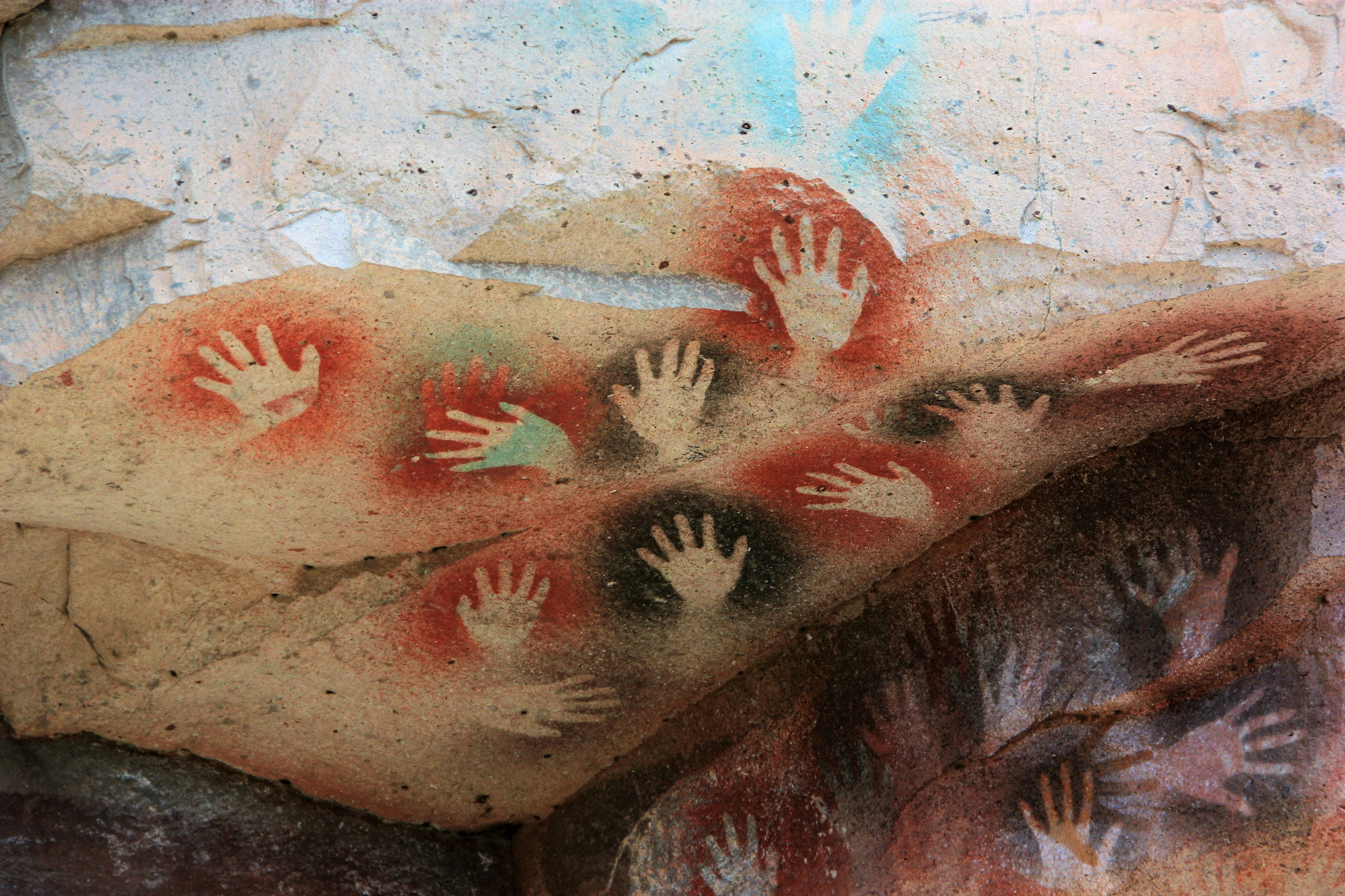 Stone Canvas: A Draped Mosaic of Handprints