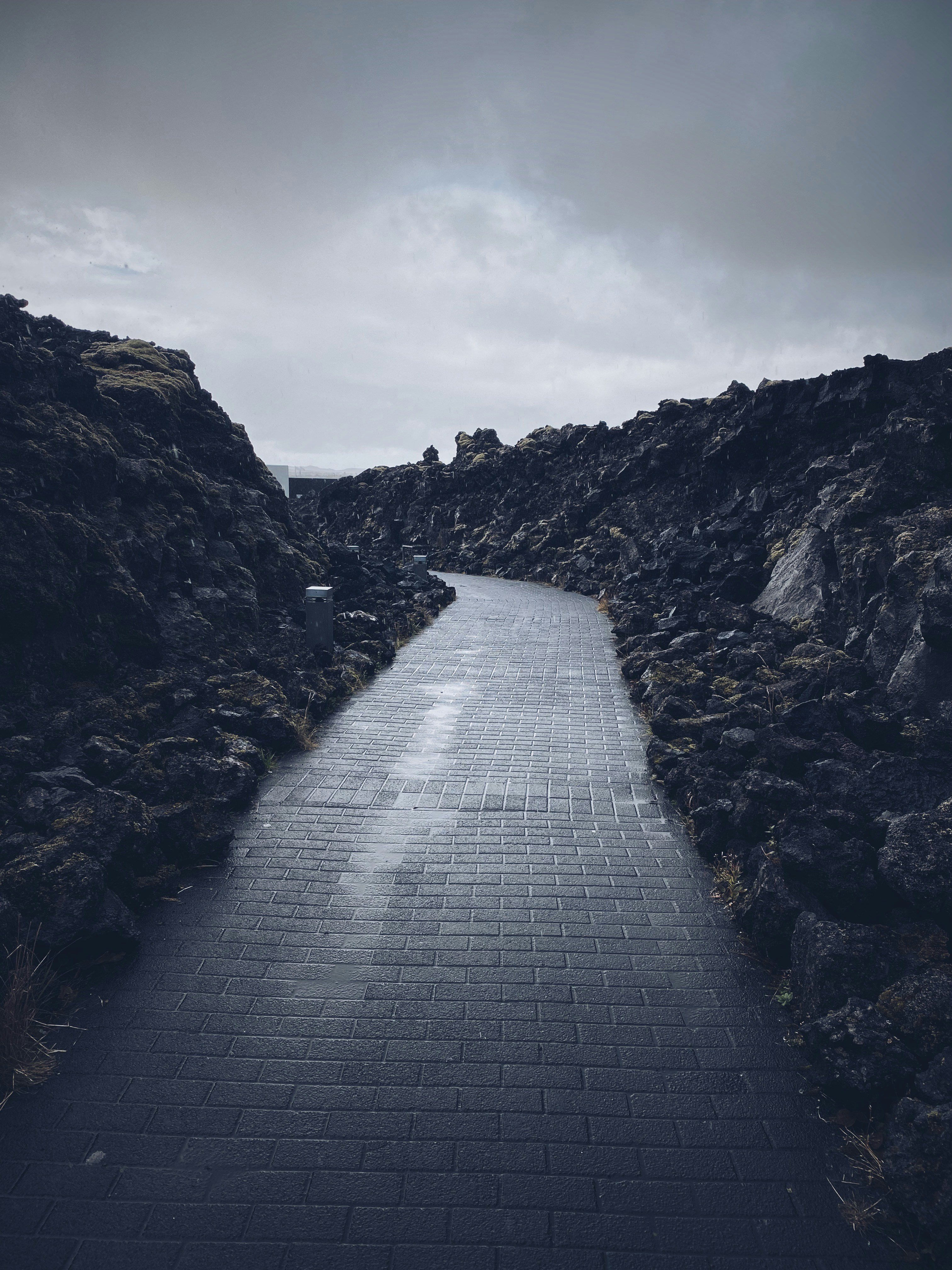 A stone pathway between rocky cliffs photo – Free Iceland Image on Unsplash