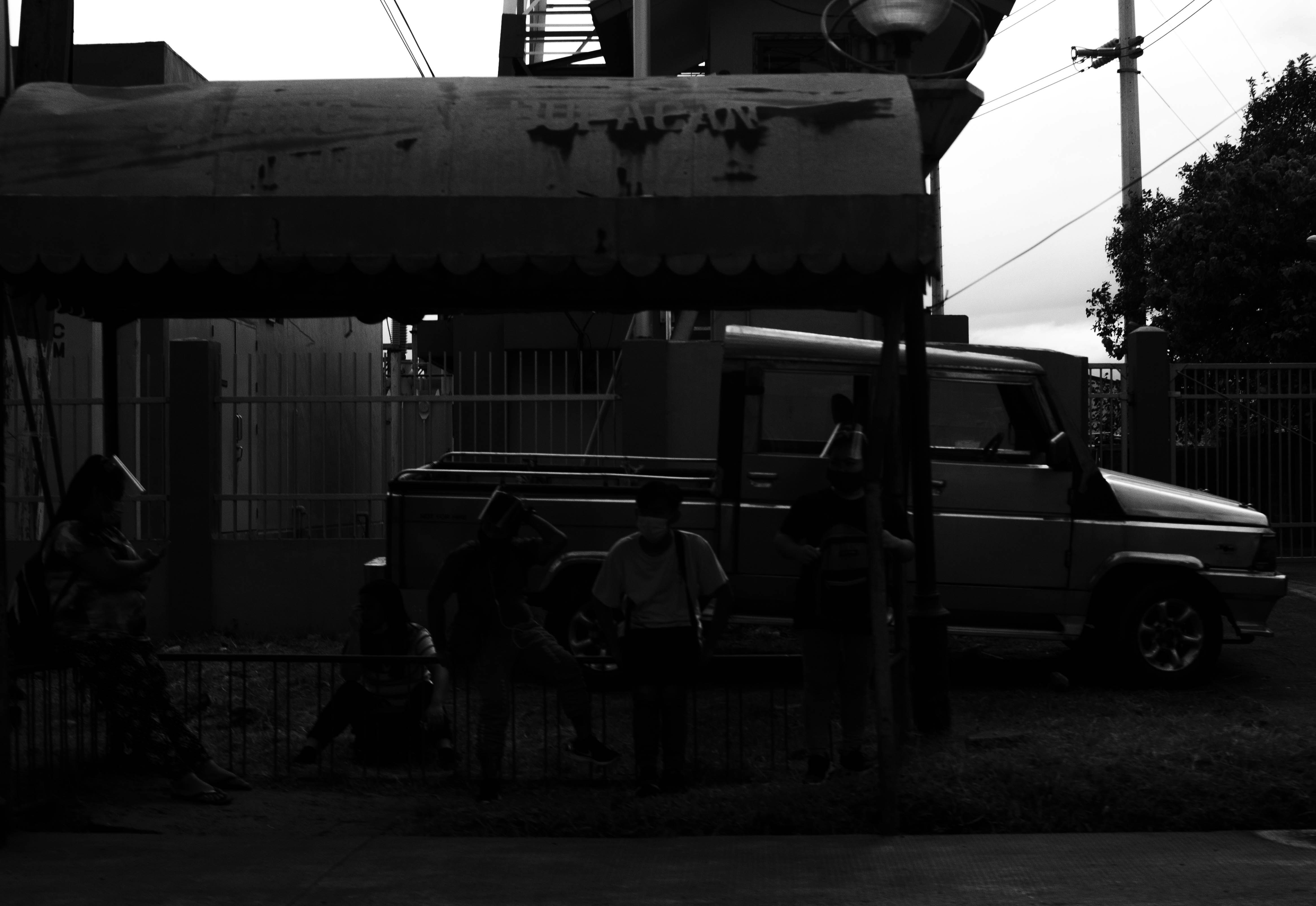 A group of people standing outside a building photo – Free Street Image ...