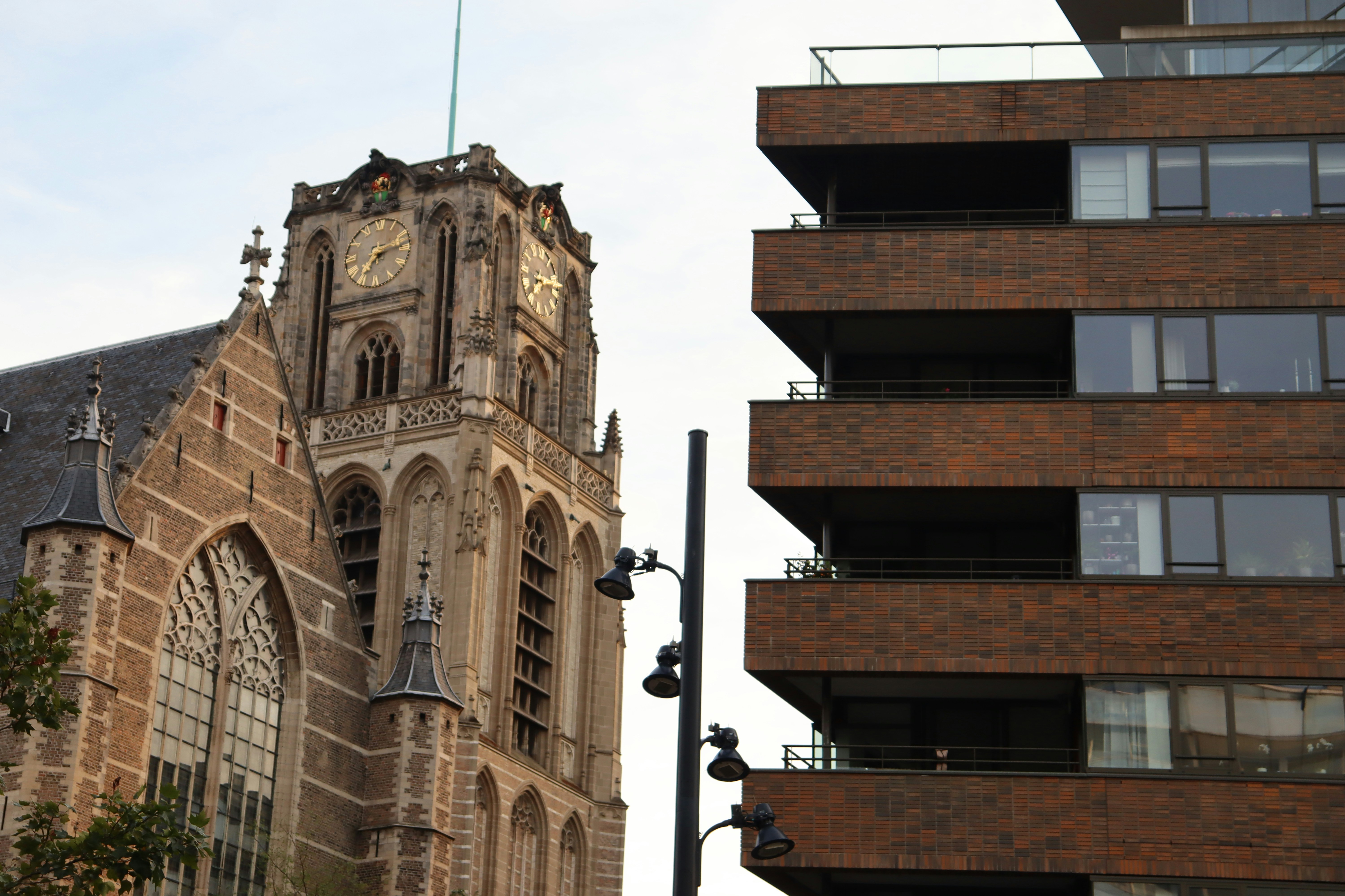 A clock on a tower photo – Free Rotterdam Image on Unsplash