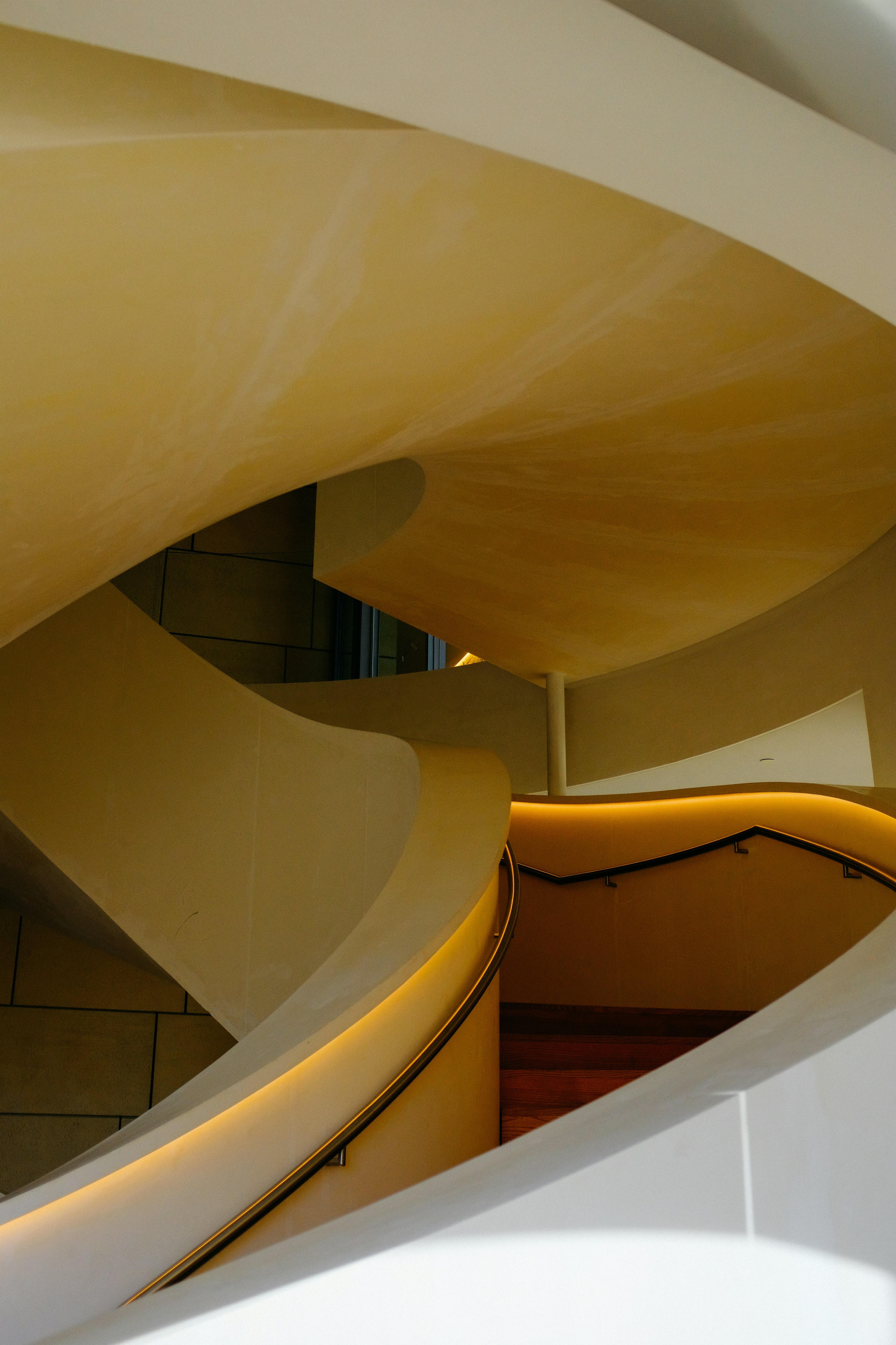 A staircase with a curved railing photo – Free Image on Unsplash