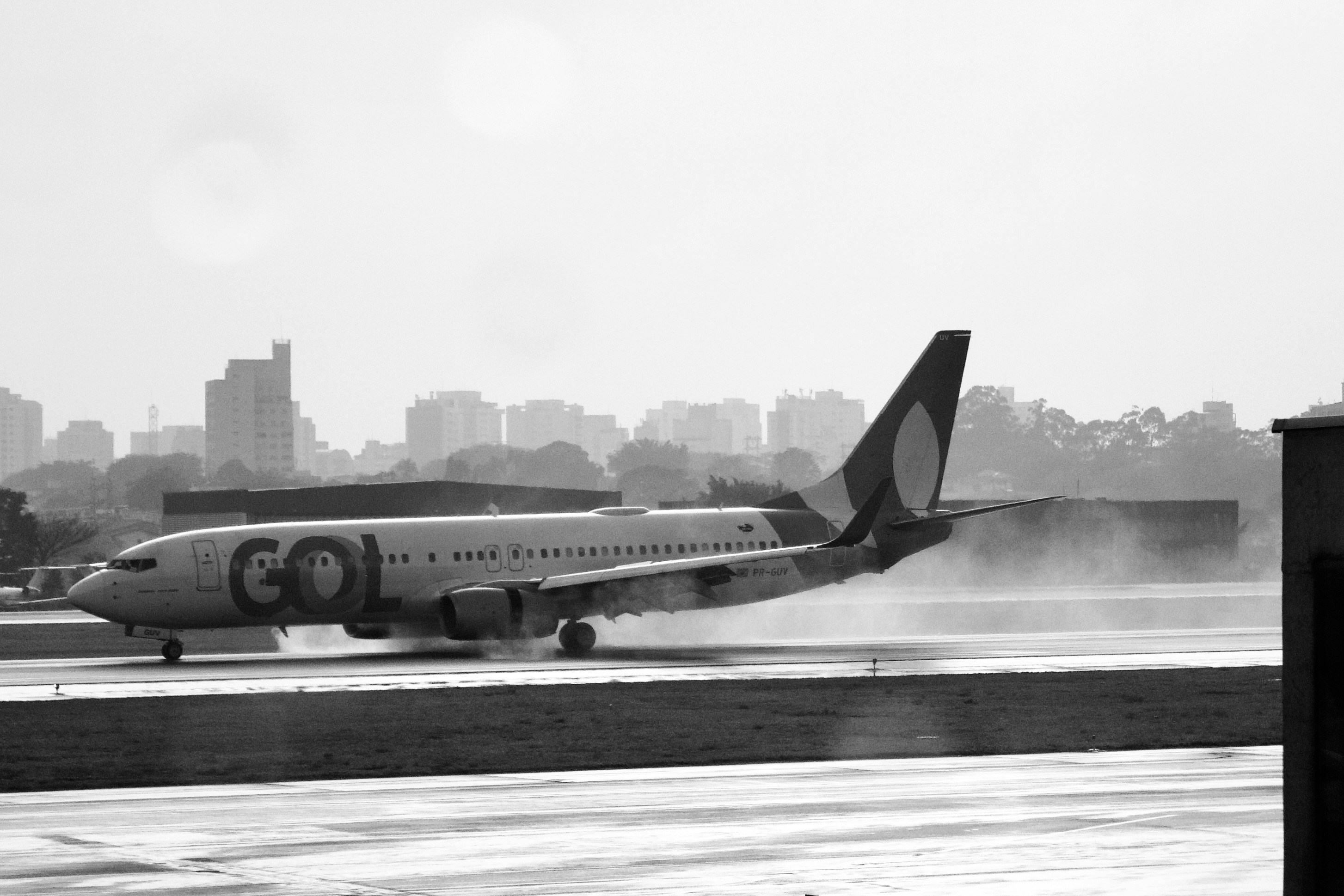 Gale at Gate: A Quiet Moment of a Jet on Wet Tarmac