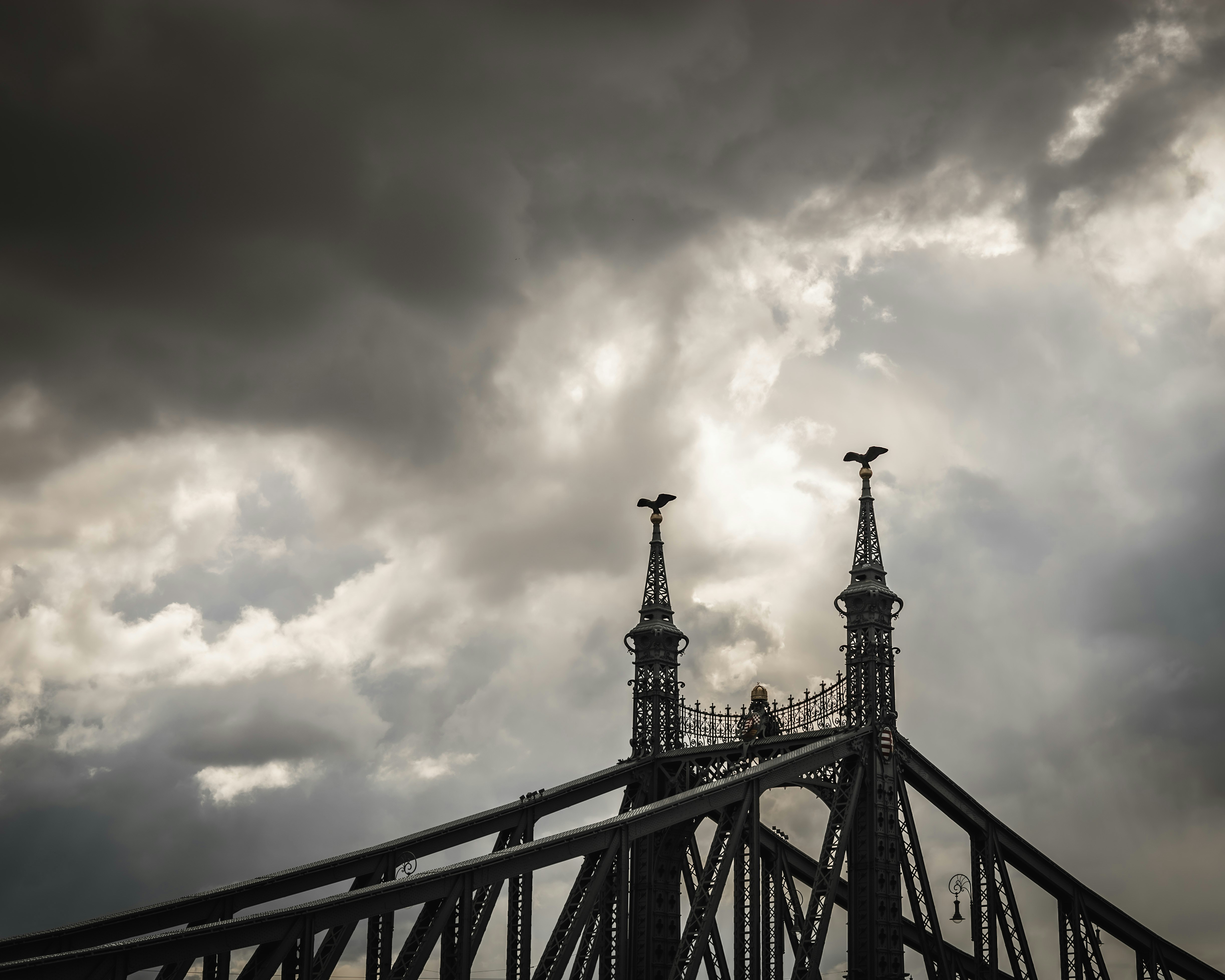 Storm-ward Spires: A Bridge Under Dark Skies