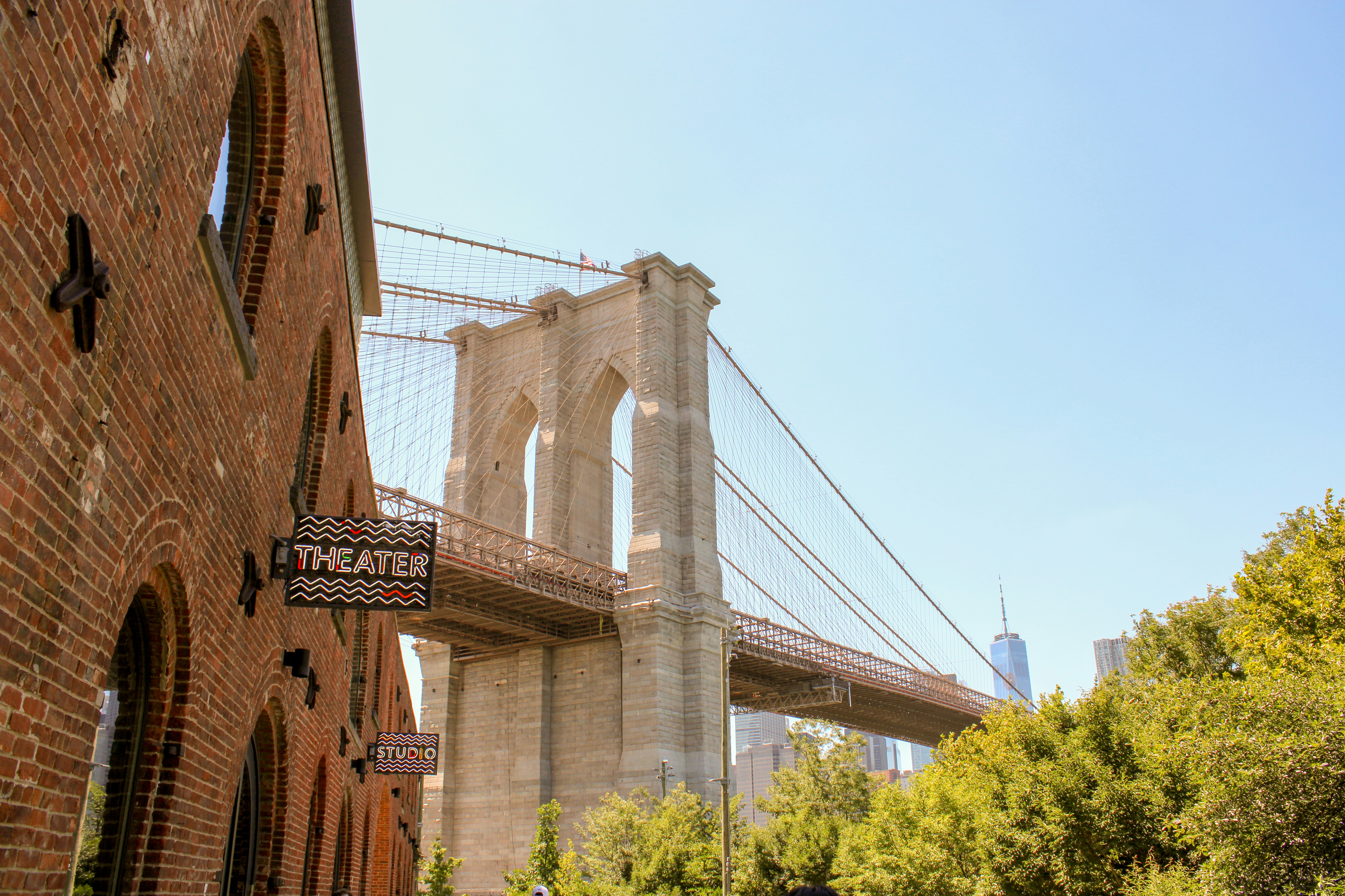 A large brick building with a bridge photo – Free New york Image on ...