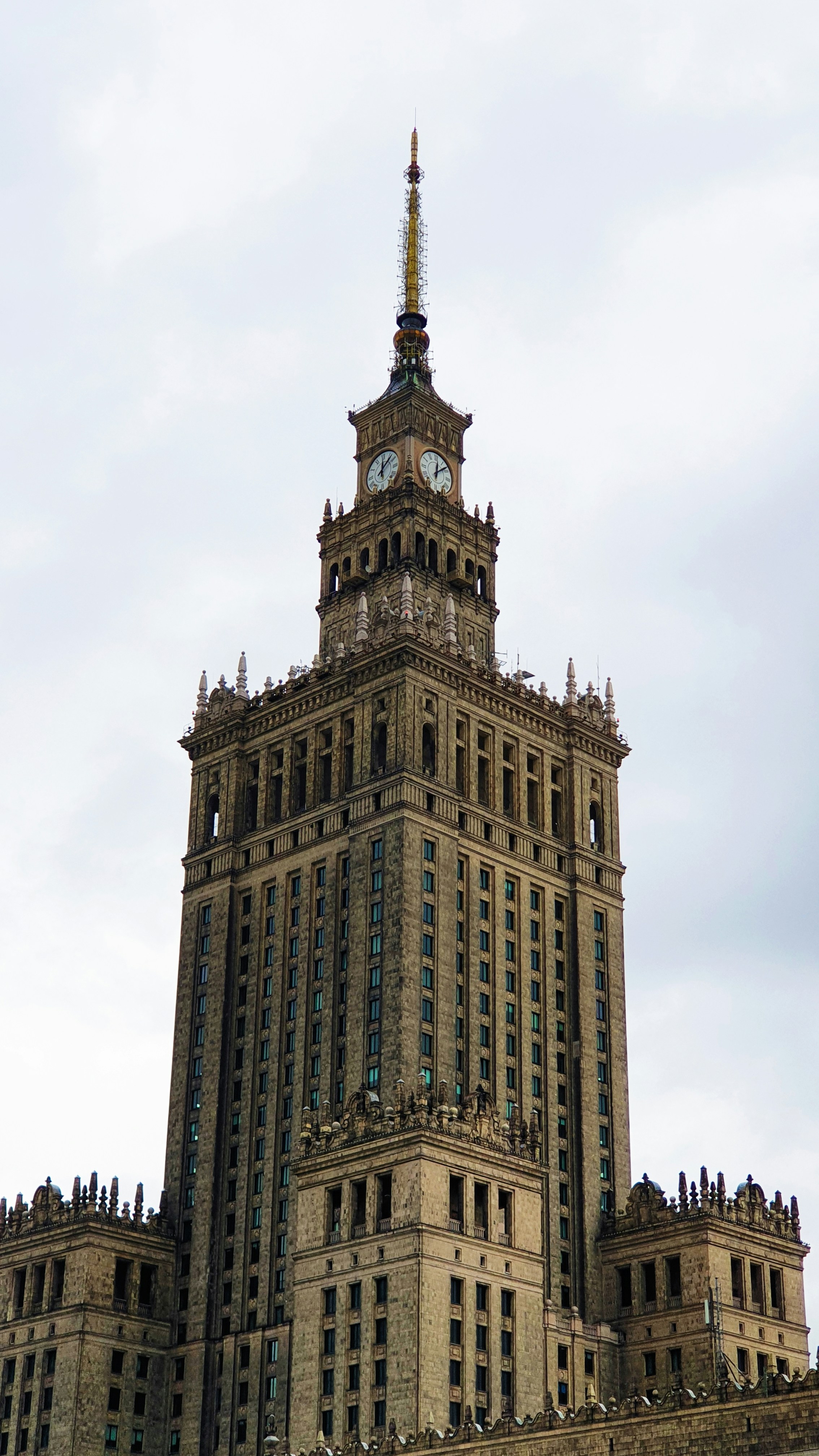 A large building towers over Palace of Culture and Science photo – Free ...