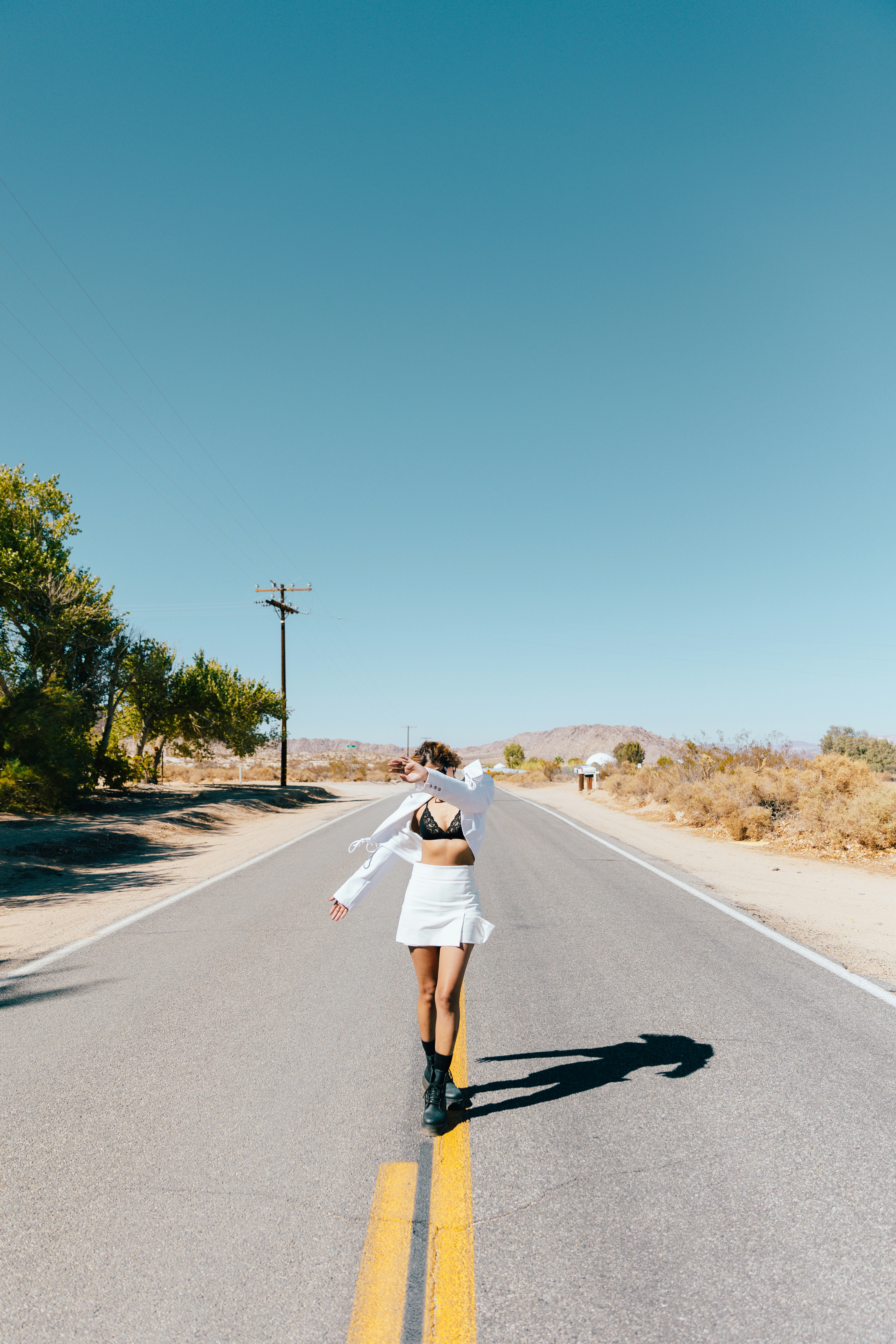 A man walking on a road photo – Free Yucca valley Image on Unsplash