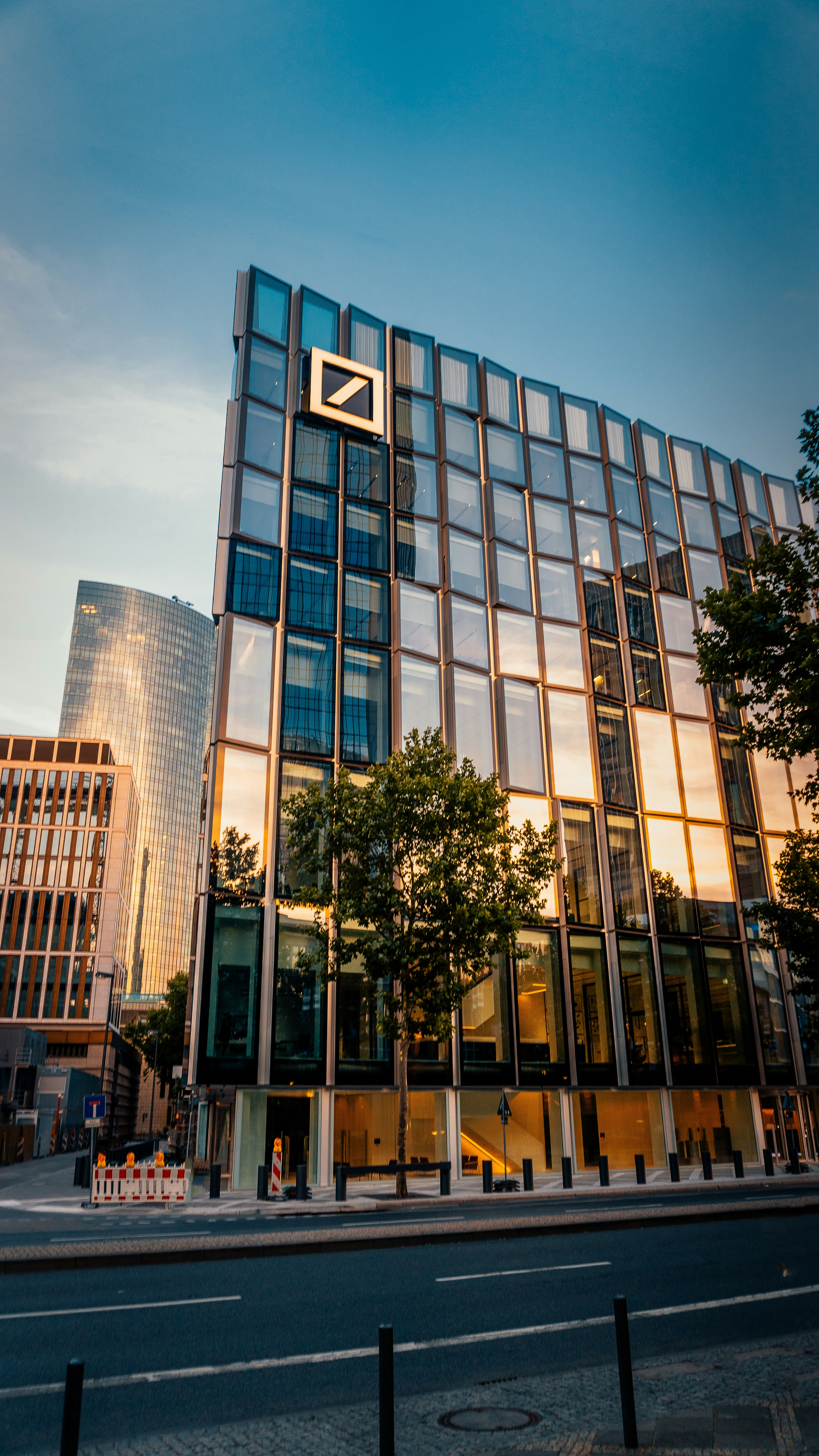 Golden Hour Grid: The Square Logo Amid a Glass Facade