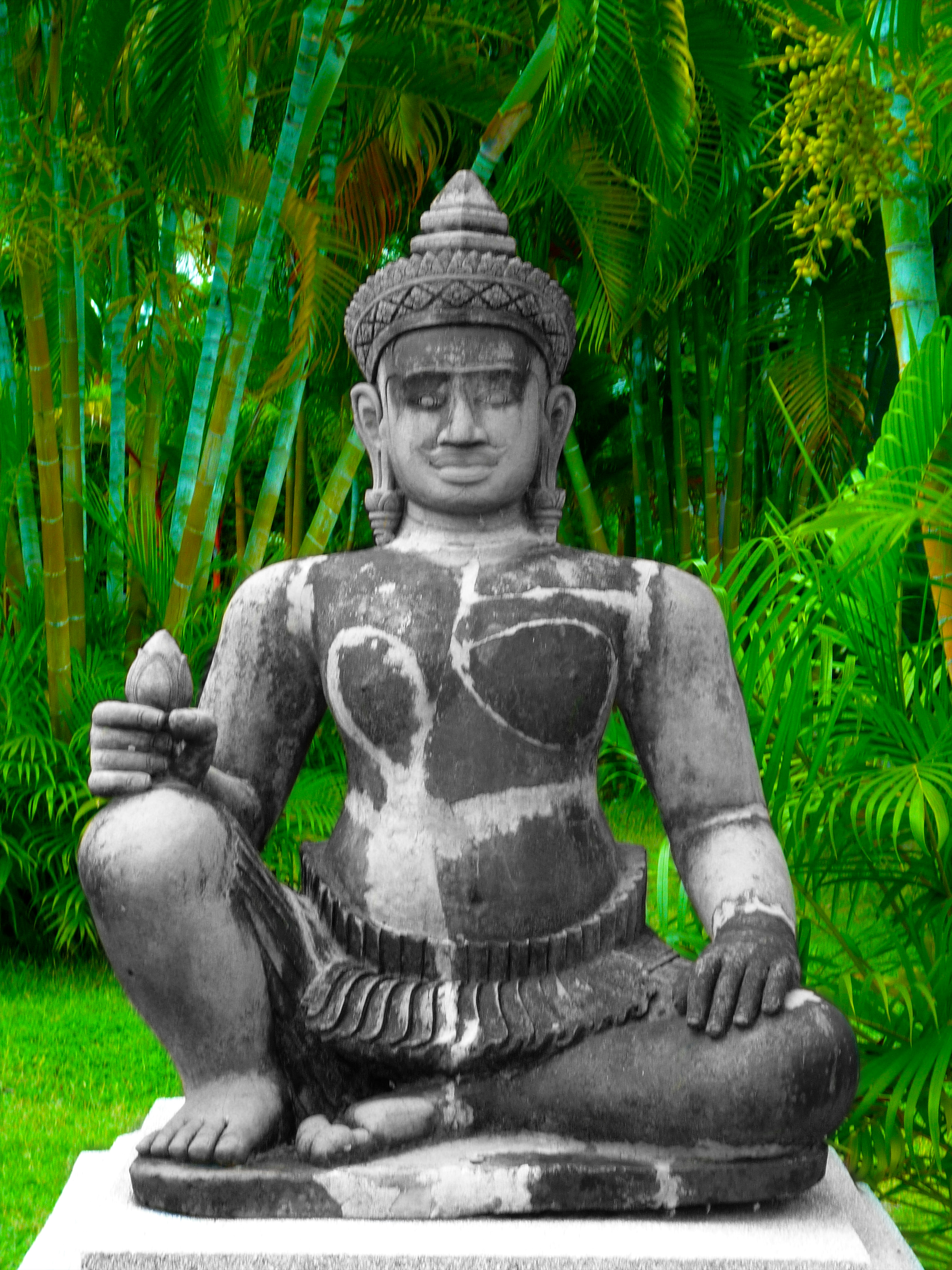 Verdant Tranquility: Stone Buddha Among Bamboo