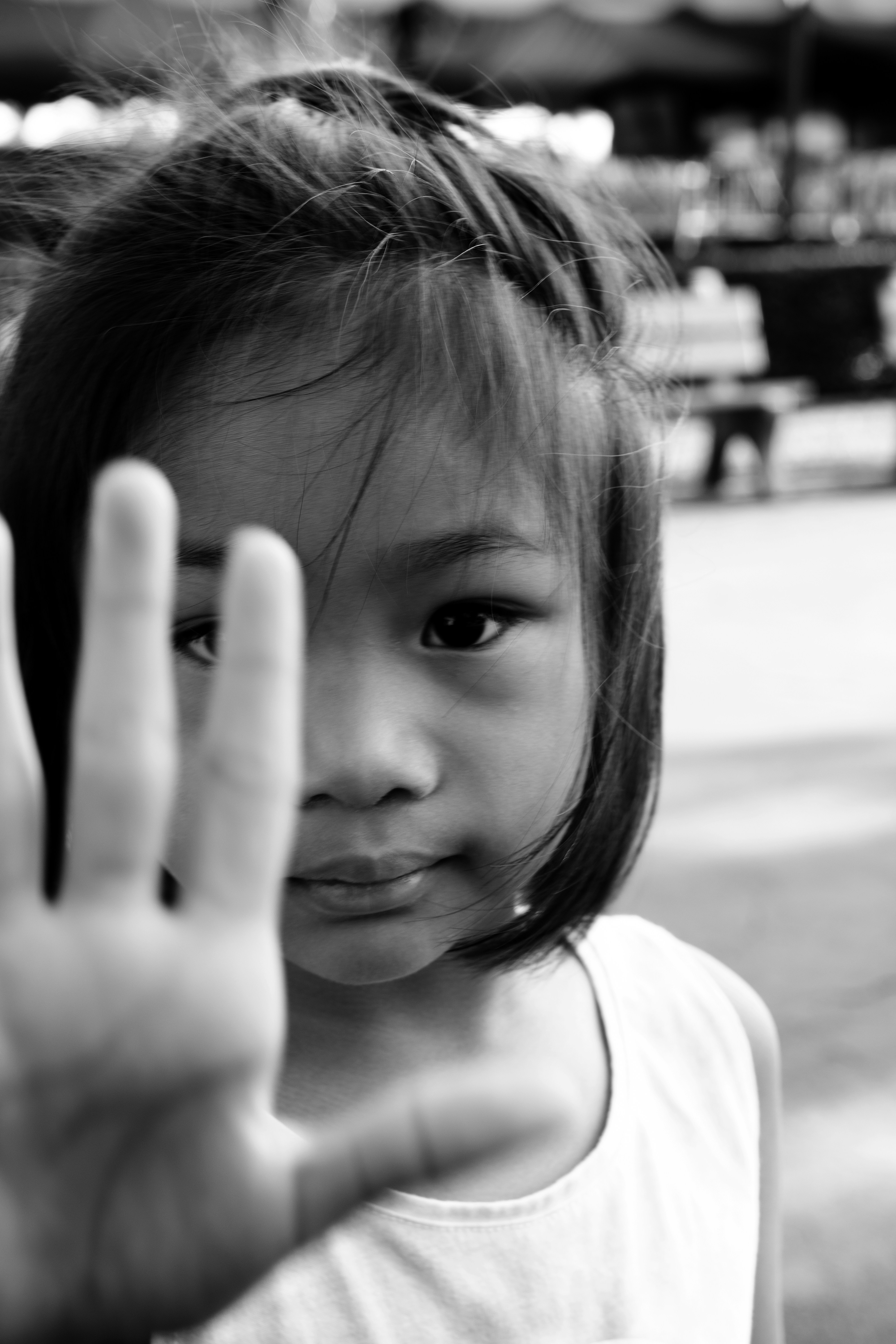A Quiet Hello: The Girl's Hand Reaches Toward the Lens
