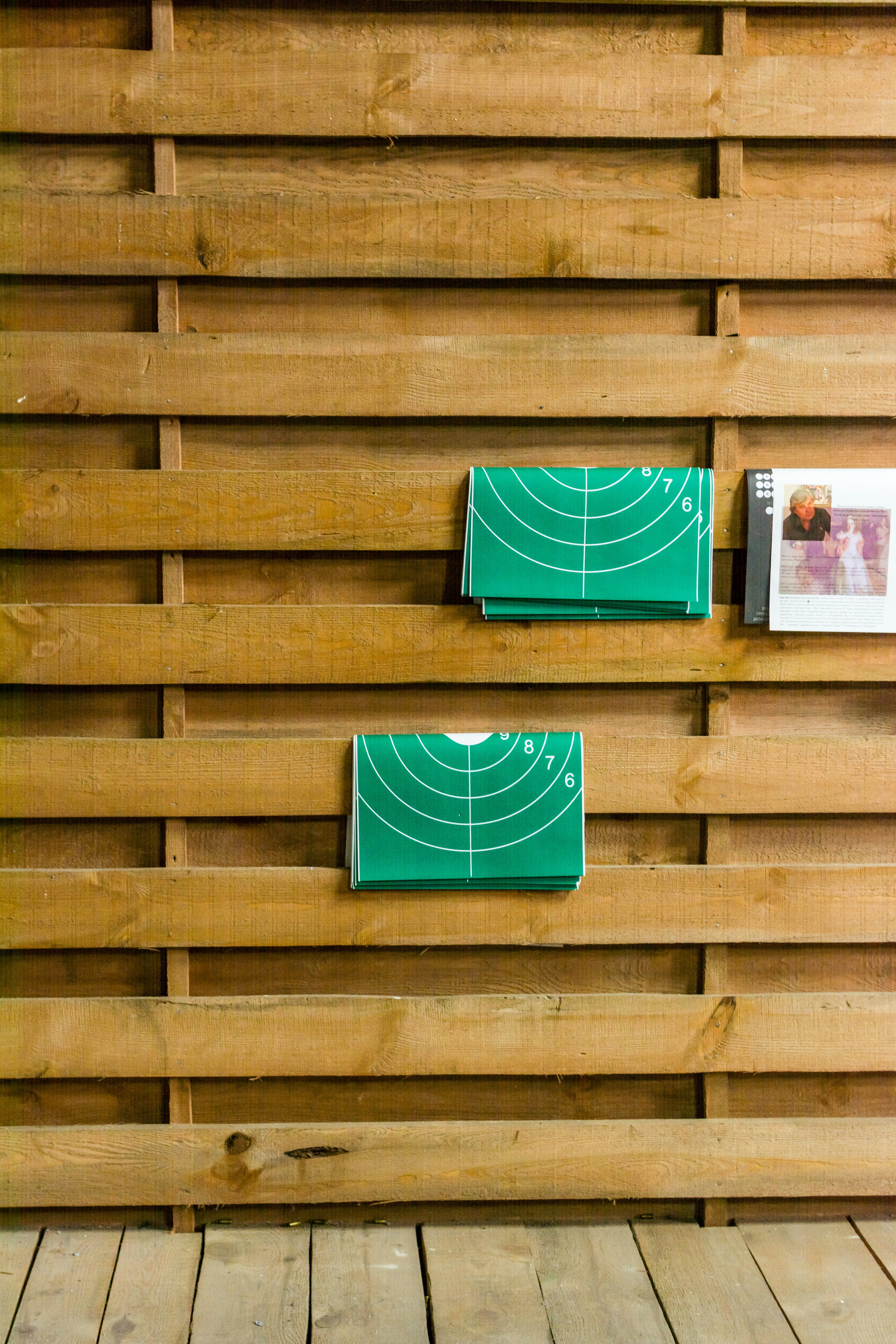 Green Target Cards on a Wooden Lattice
