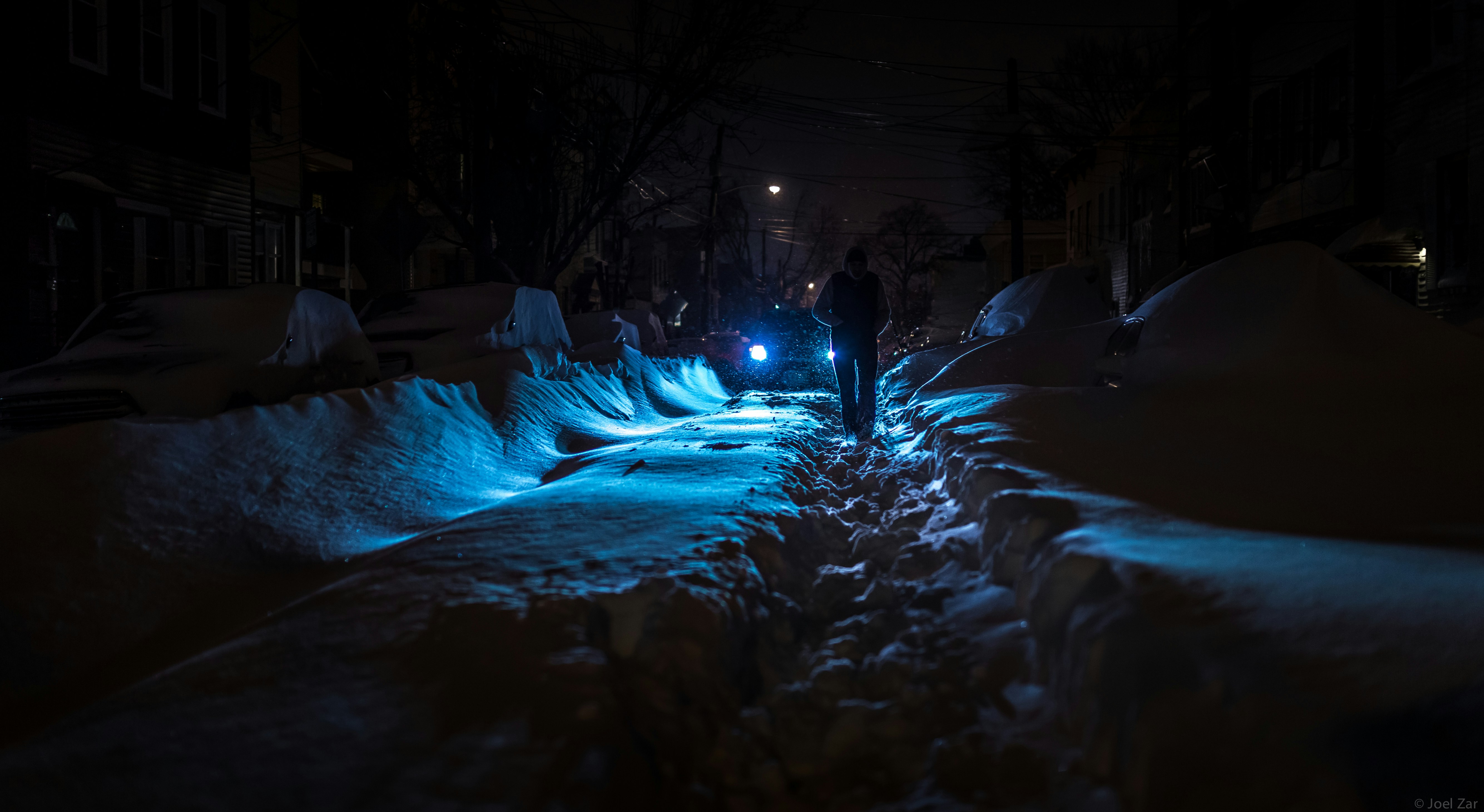 Blue Beacon on a Snowbound Street at Night