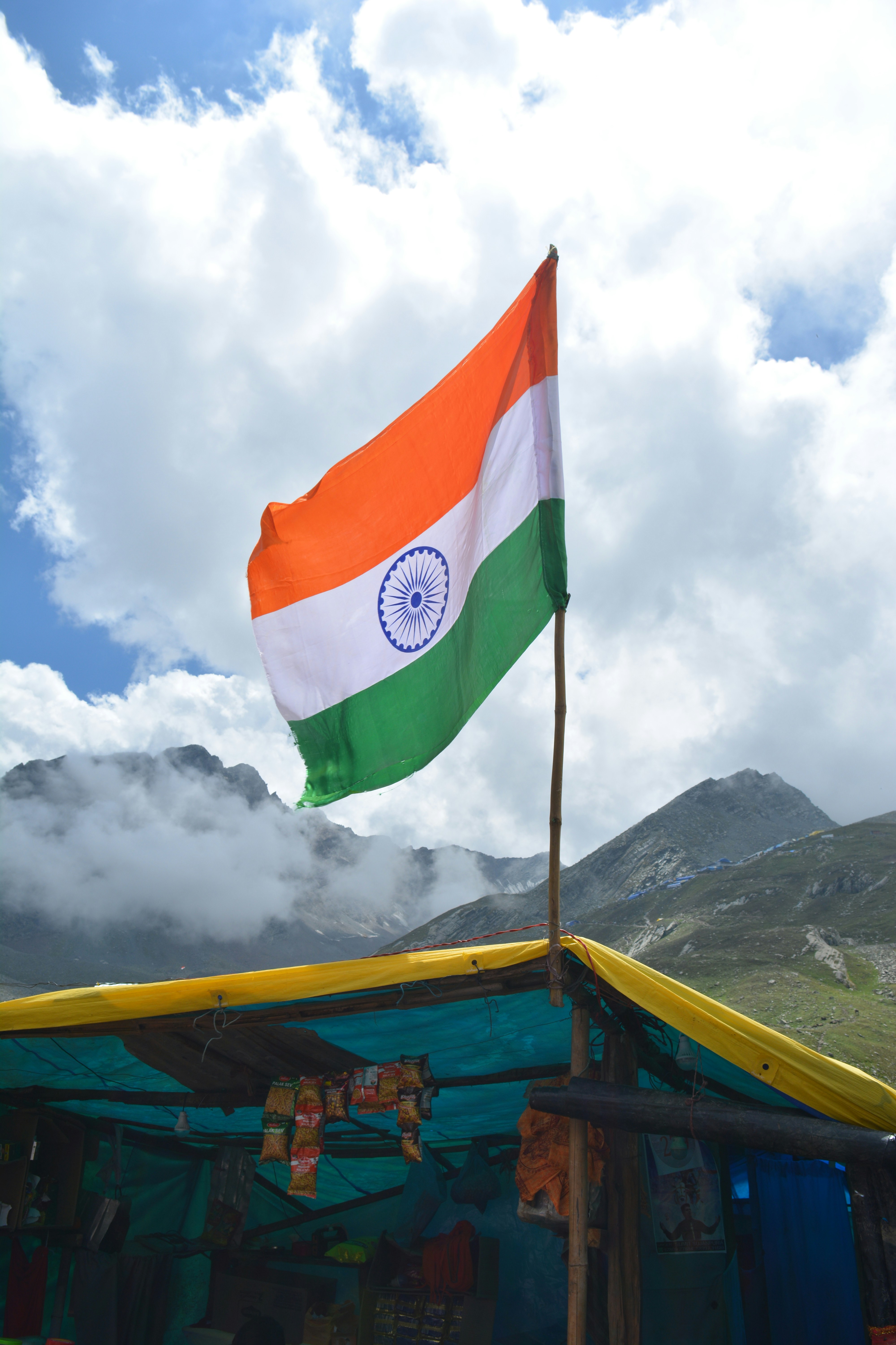 Flag on a Wind-Swept Peak: India’s Tricolor Above a Himalayan Backdrop