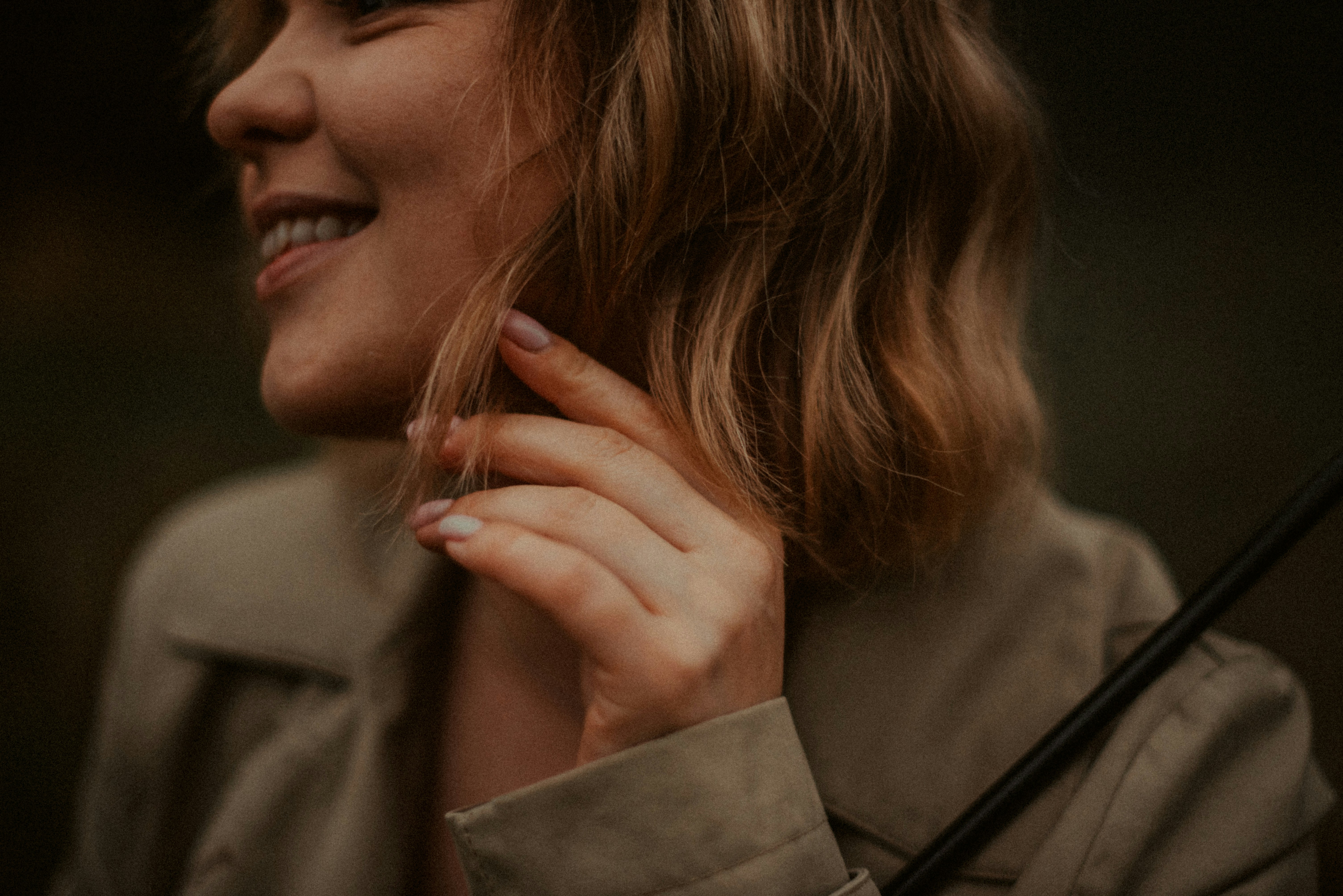 A woman holding her hand to her face photo – Free Human Image on Unsplash