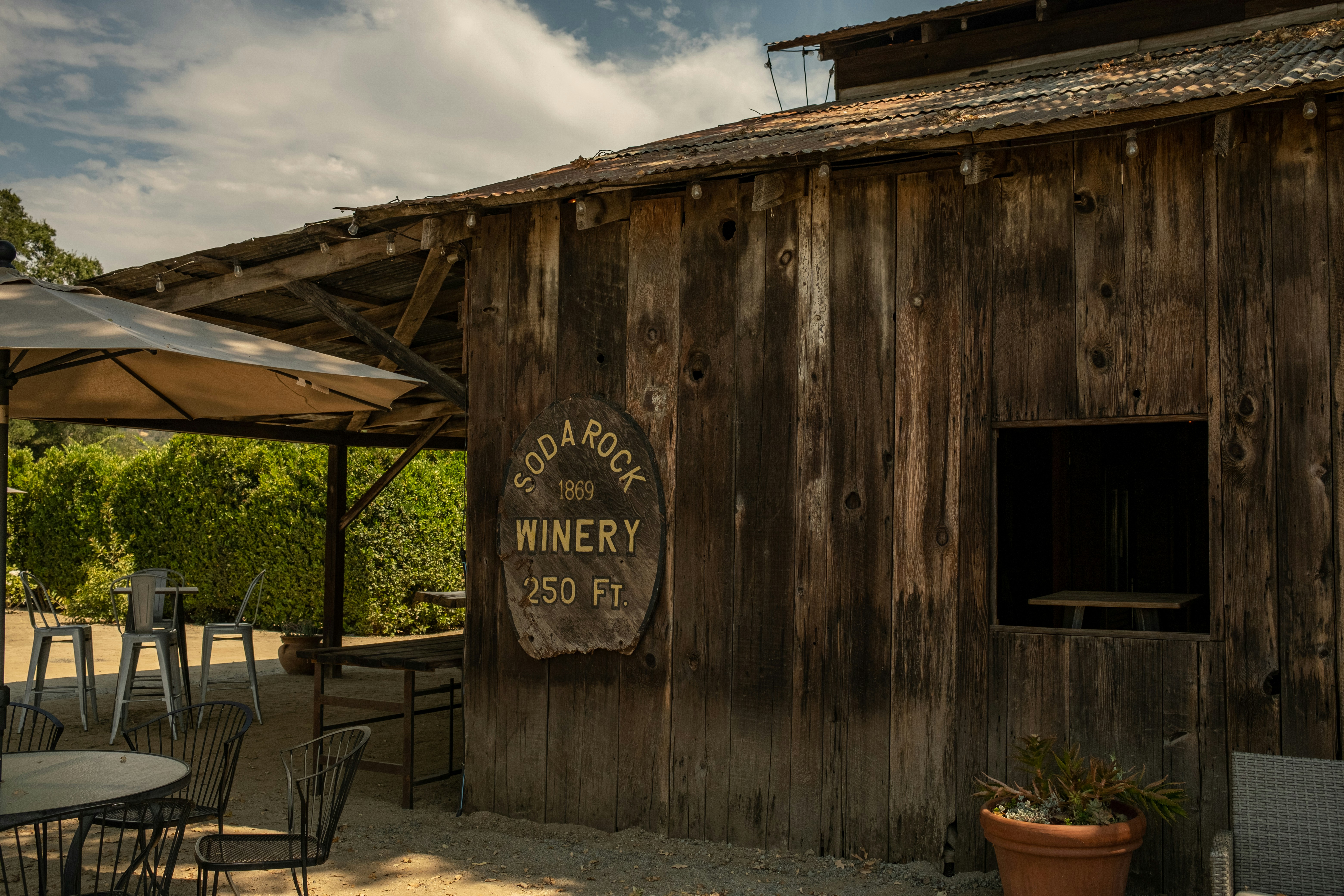 Weathered Soda Rock Winery Facade: Sunlit Wood and Quiet Patio