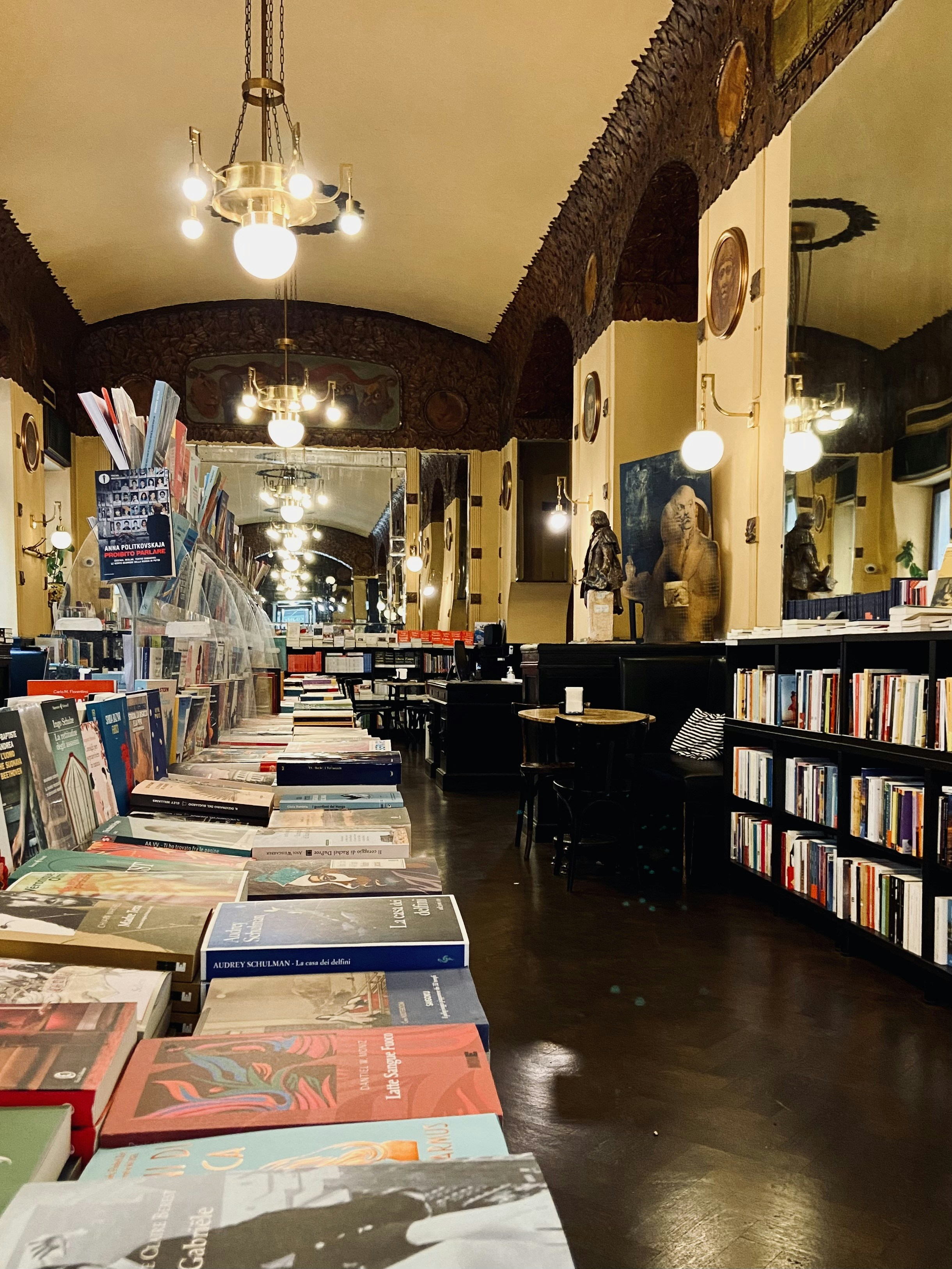 Lantern-Lit Aisle: Books Stretch Through a Cathedral-Ceiling Library