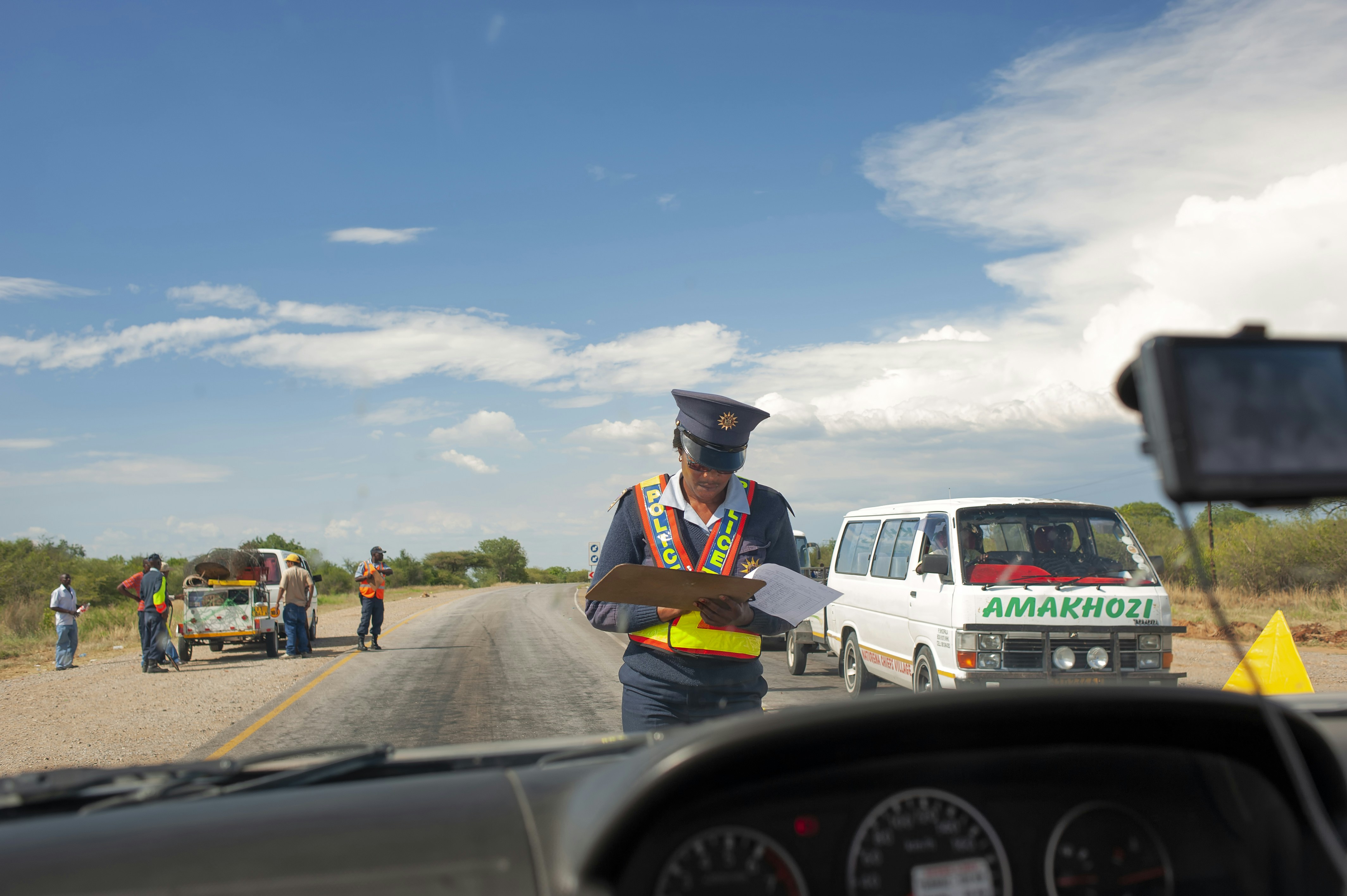 a police officer standing in the middle of the road
