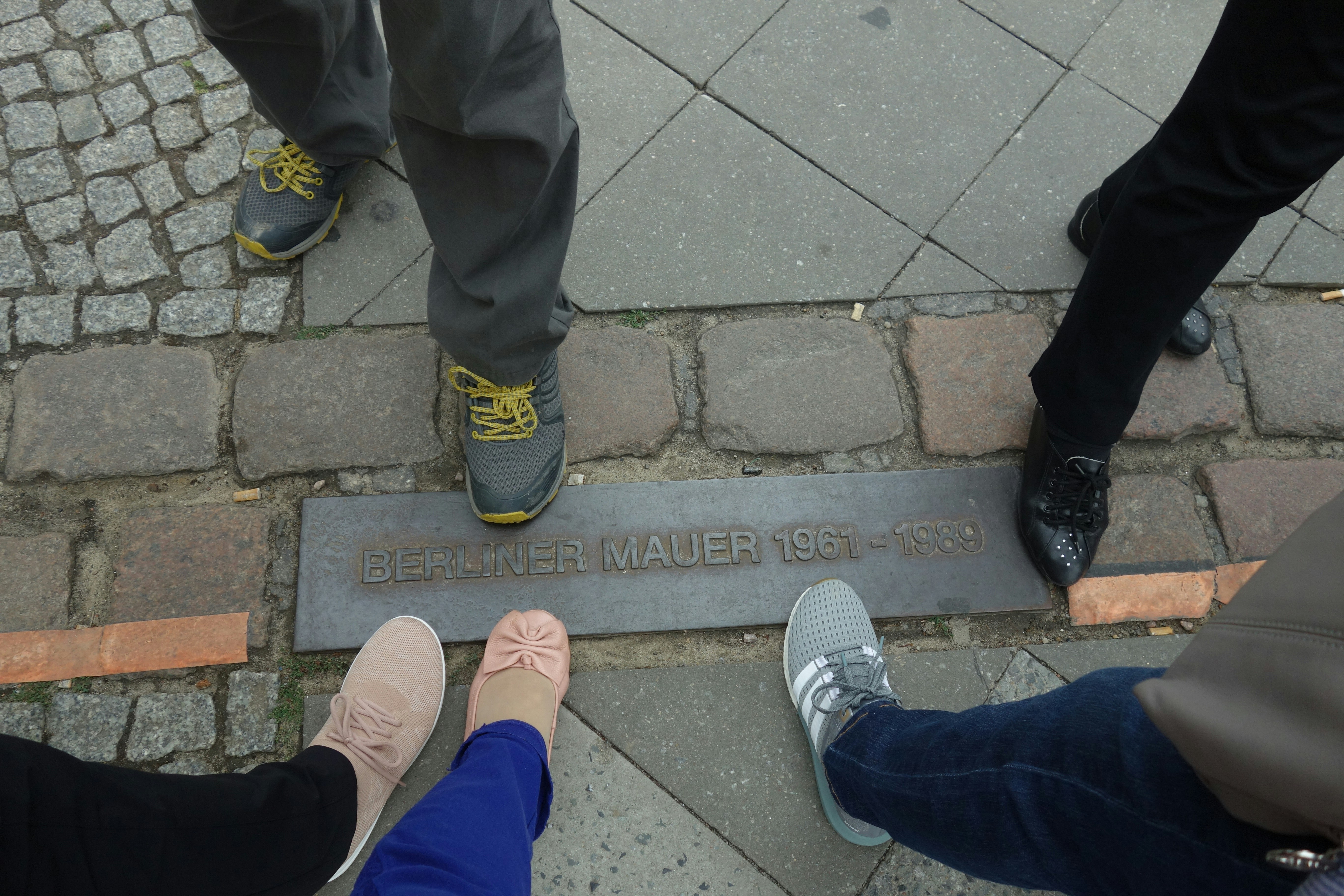 Circles of footsteps around a commemorative plaque