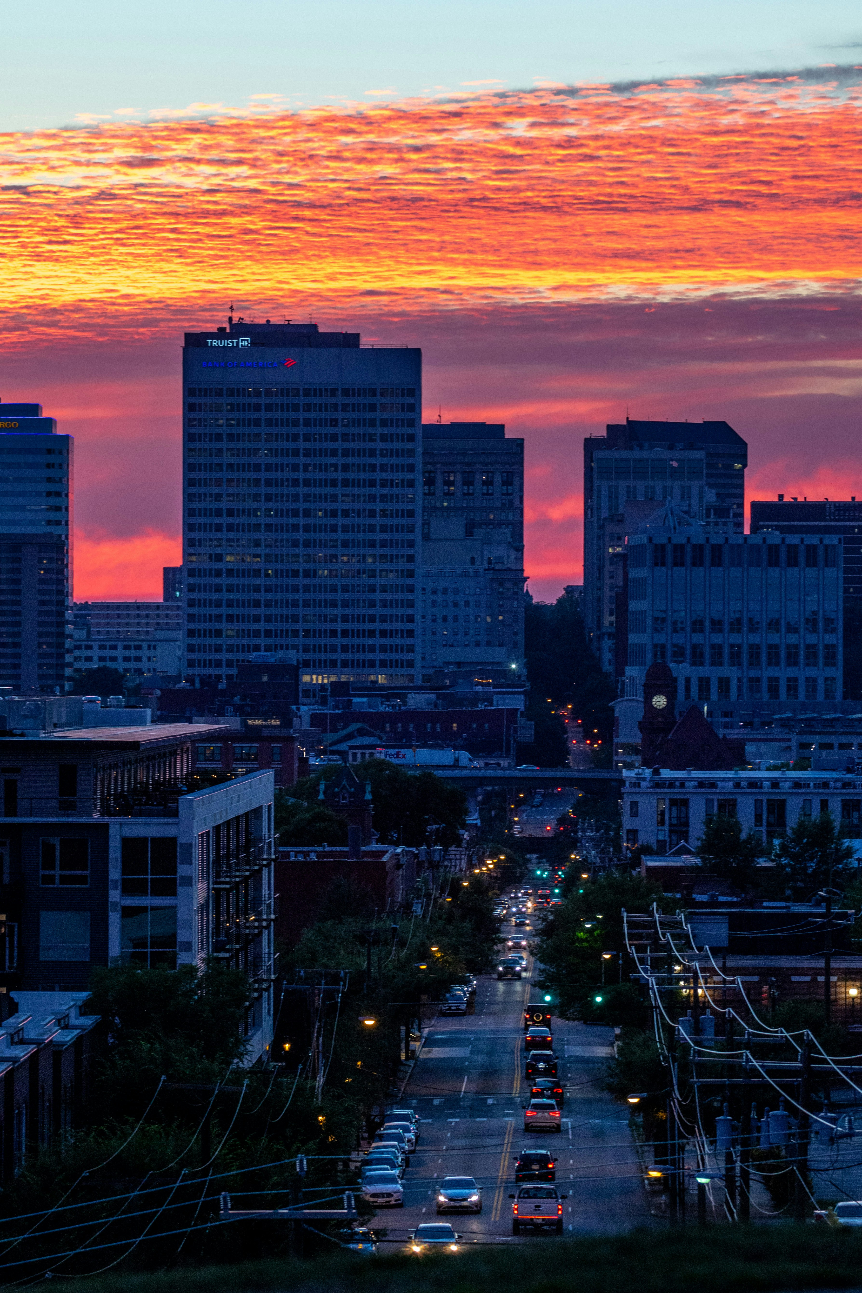 Ember Skies Over Downtown: The Long Road Beneath a Fiery Sunset