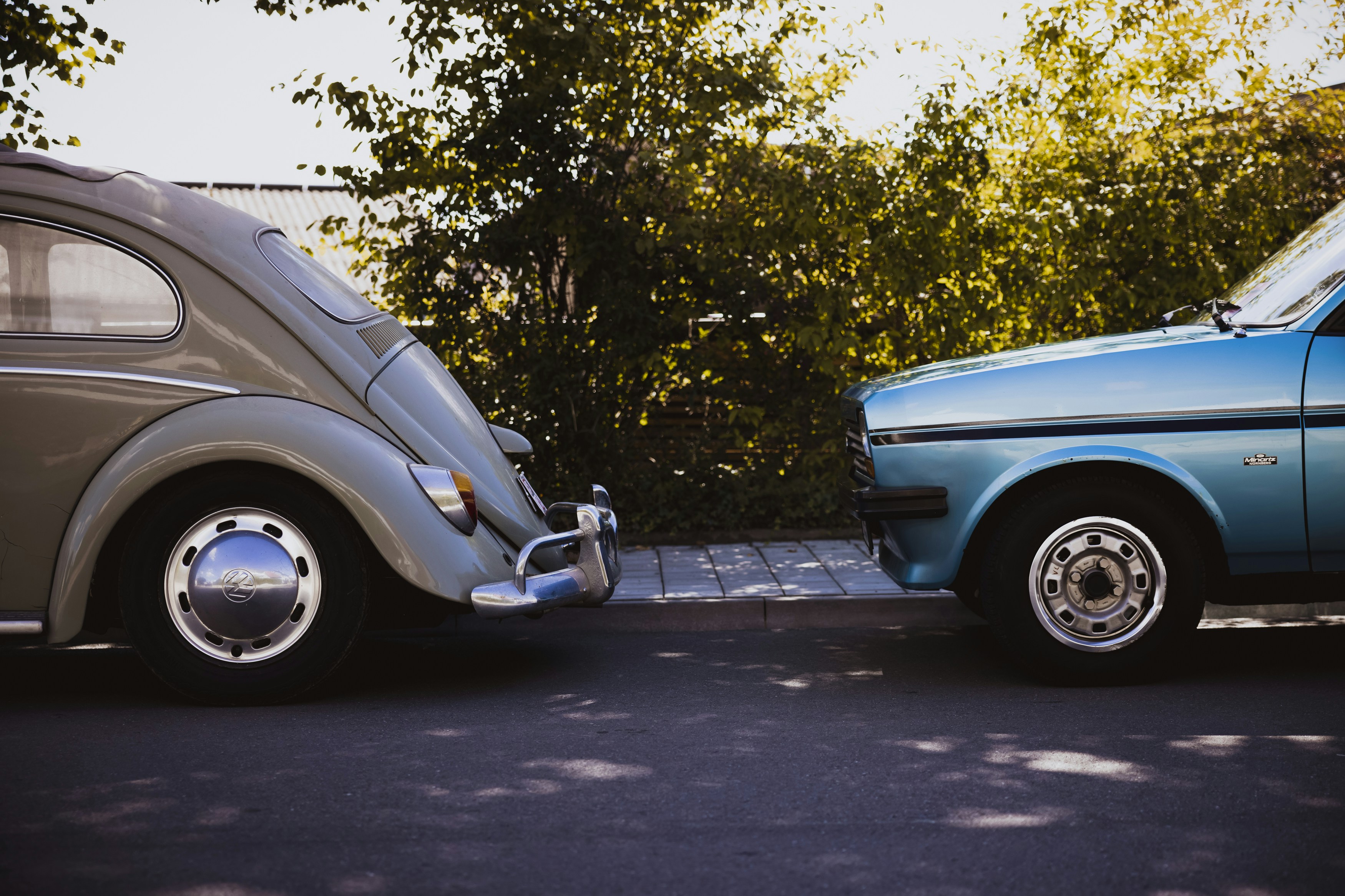 A couple of cars parked next to each other photo – Free Car Image on ...