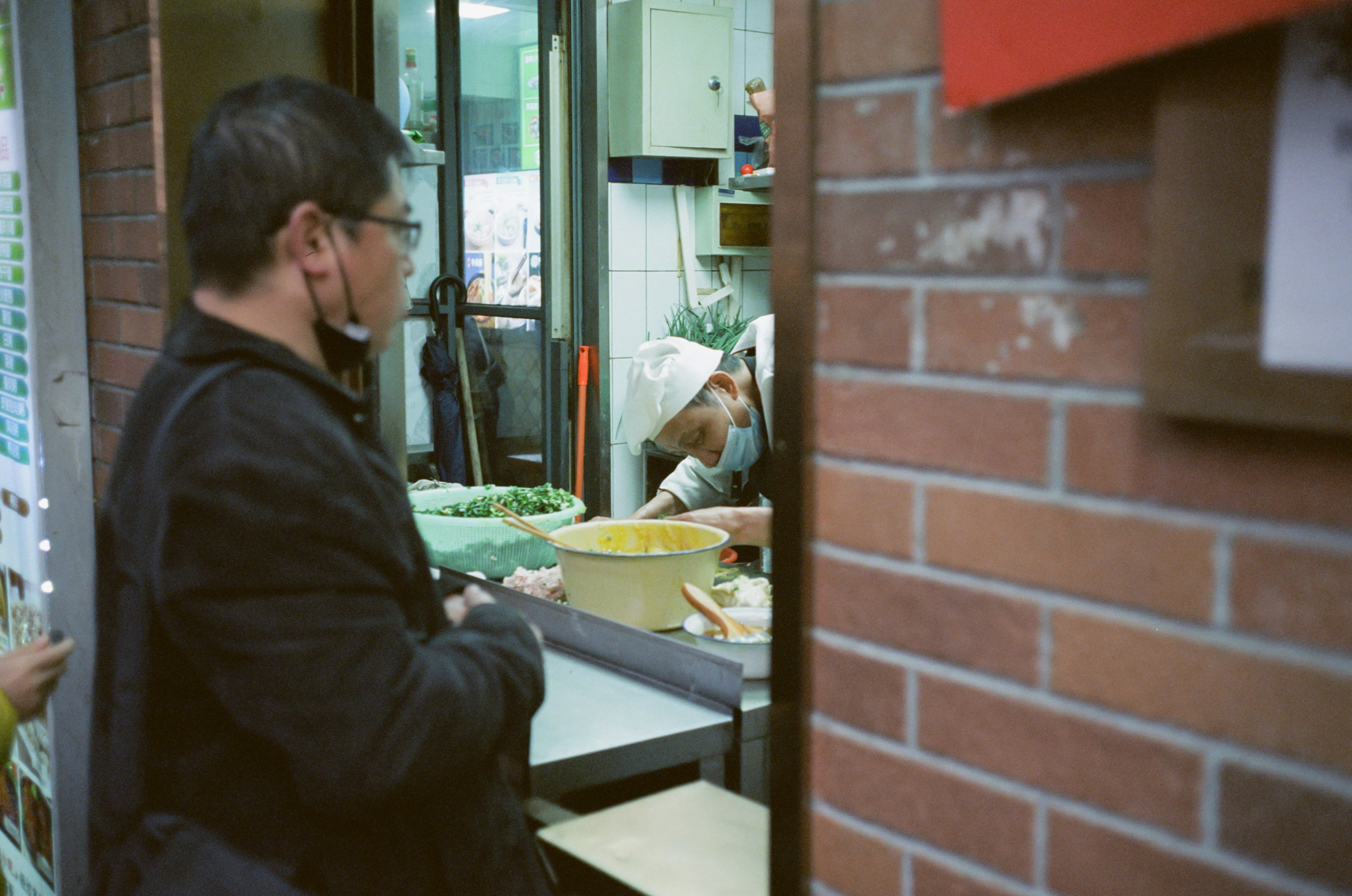 A person standing outside a building photo – Free Film Image on Unsplash