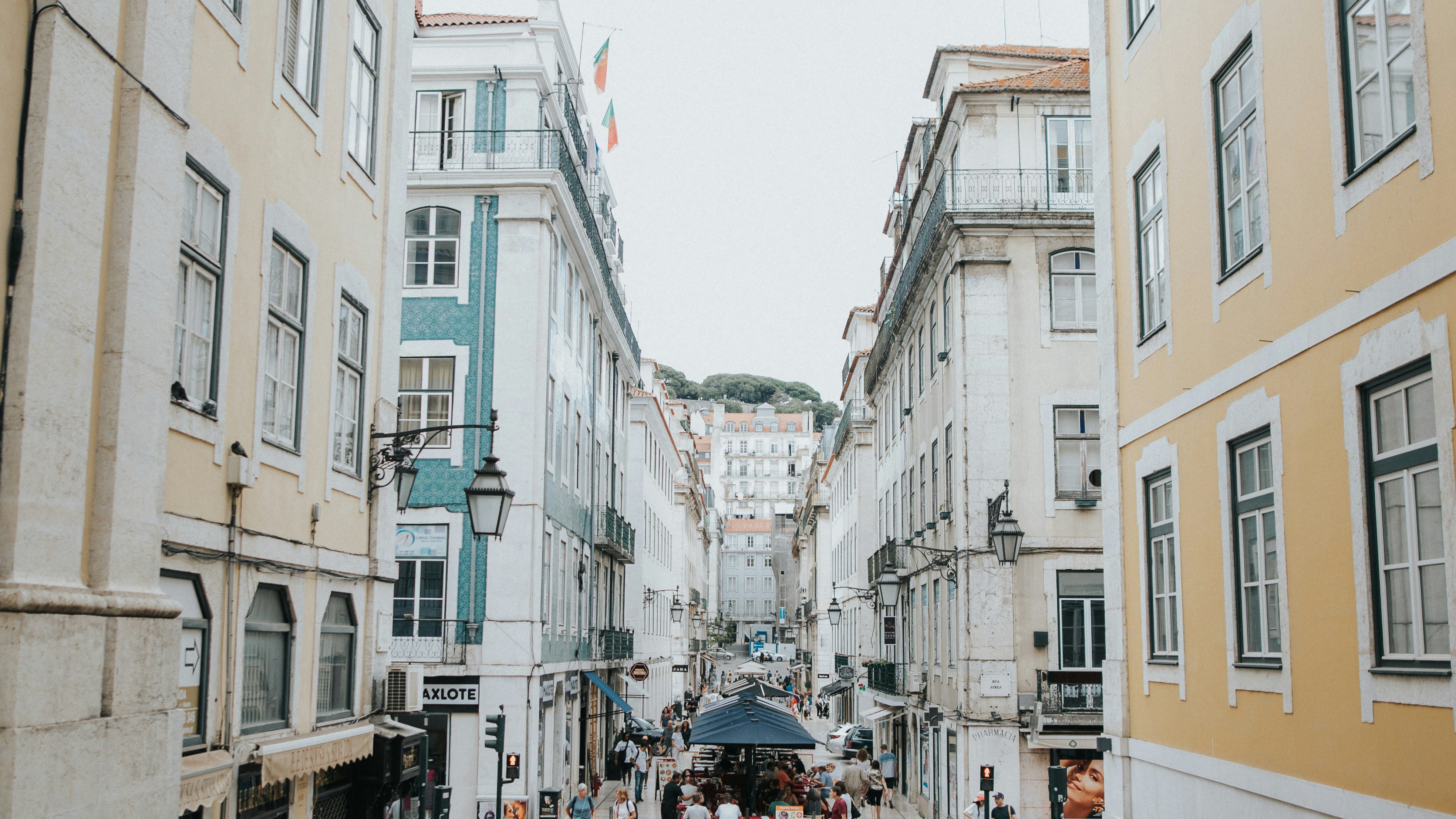 A group of buildings with people walking around photo – Free Lisbon ...