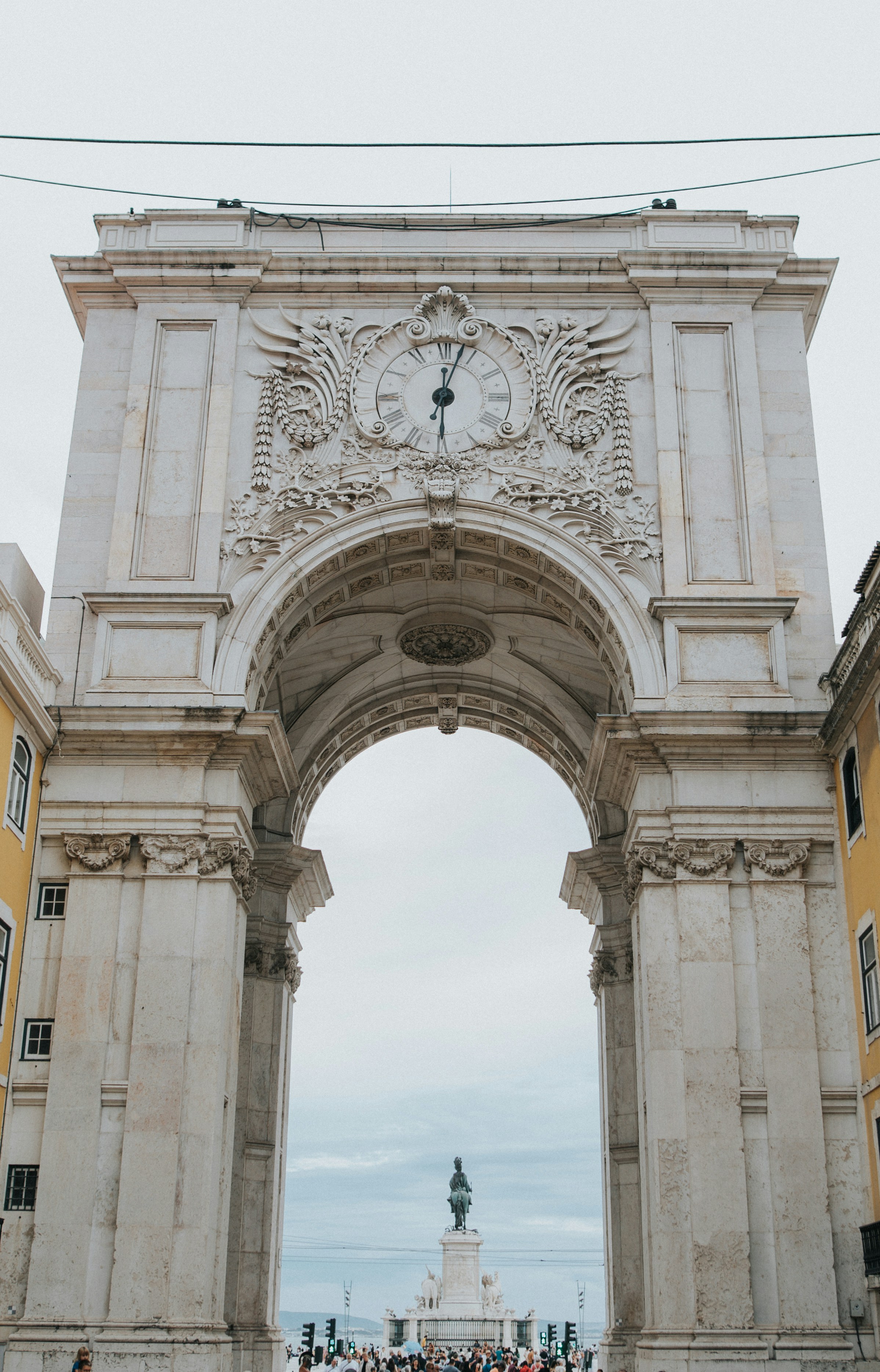 A large clock on a stone archway photo – Free Lisbon Image on Unsplash