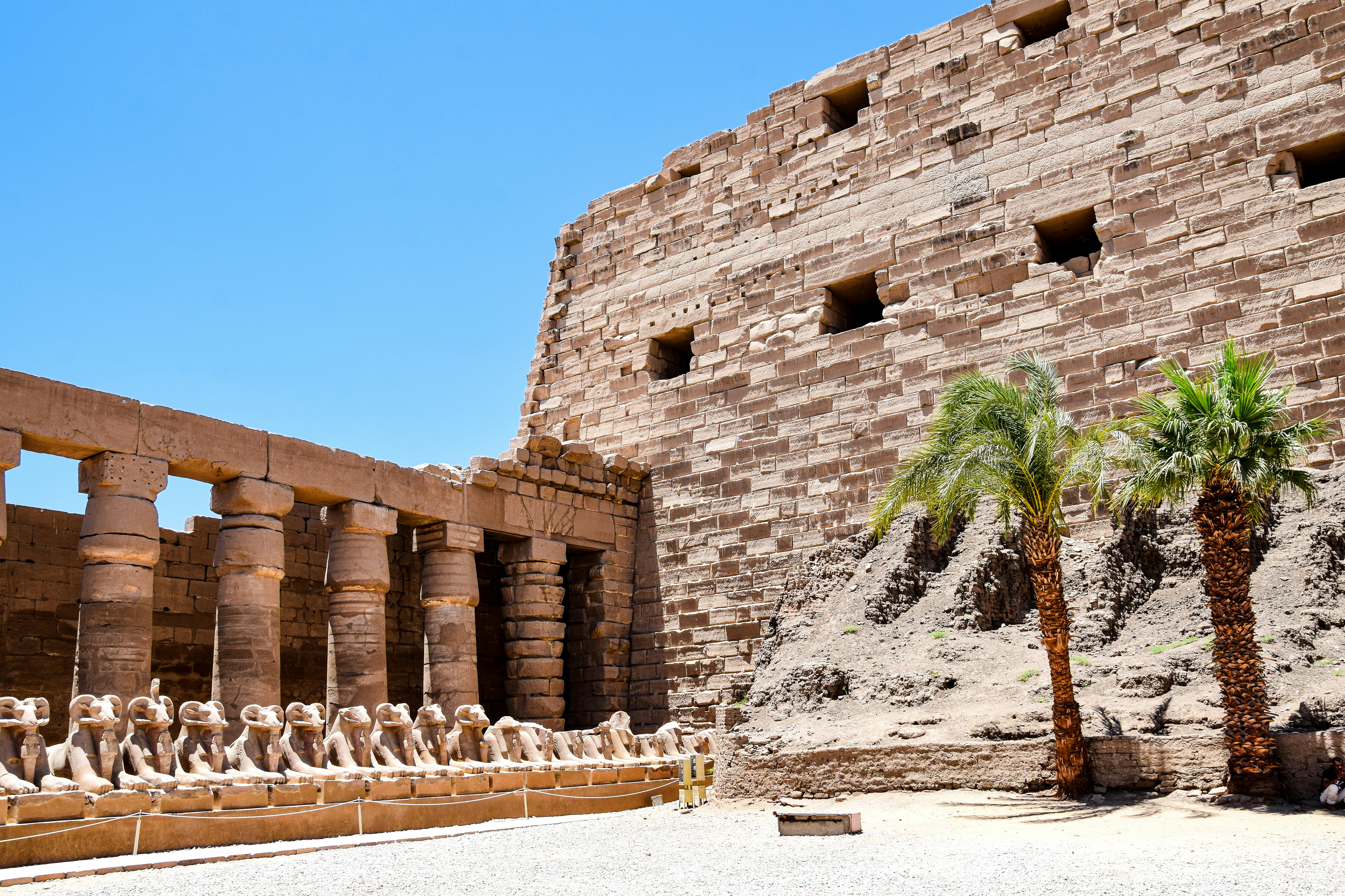 A group of statues outside of a building photo – Free Luxor Image on ...