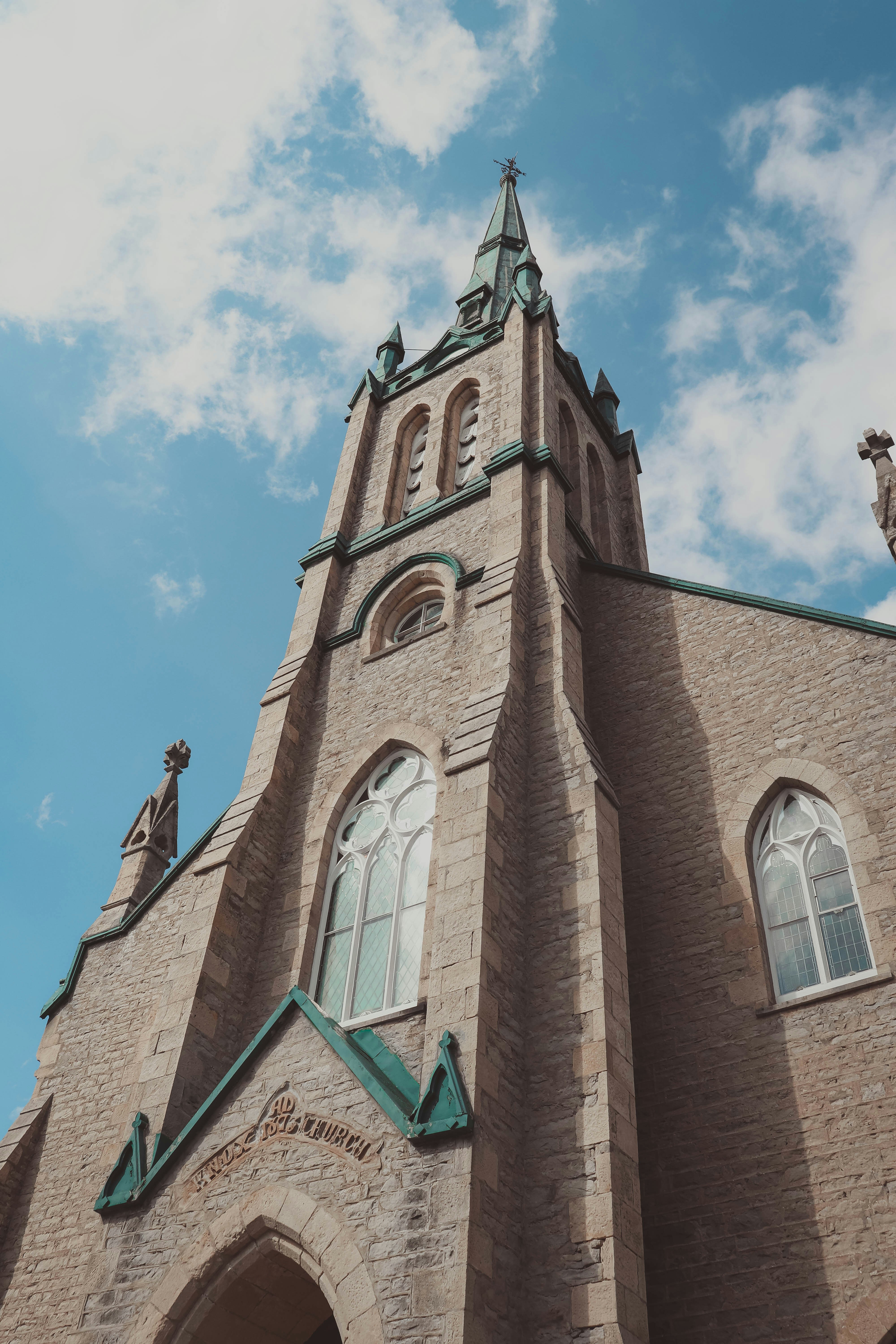 A tall brick building with a tower photo – Free Architecture Image on ...