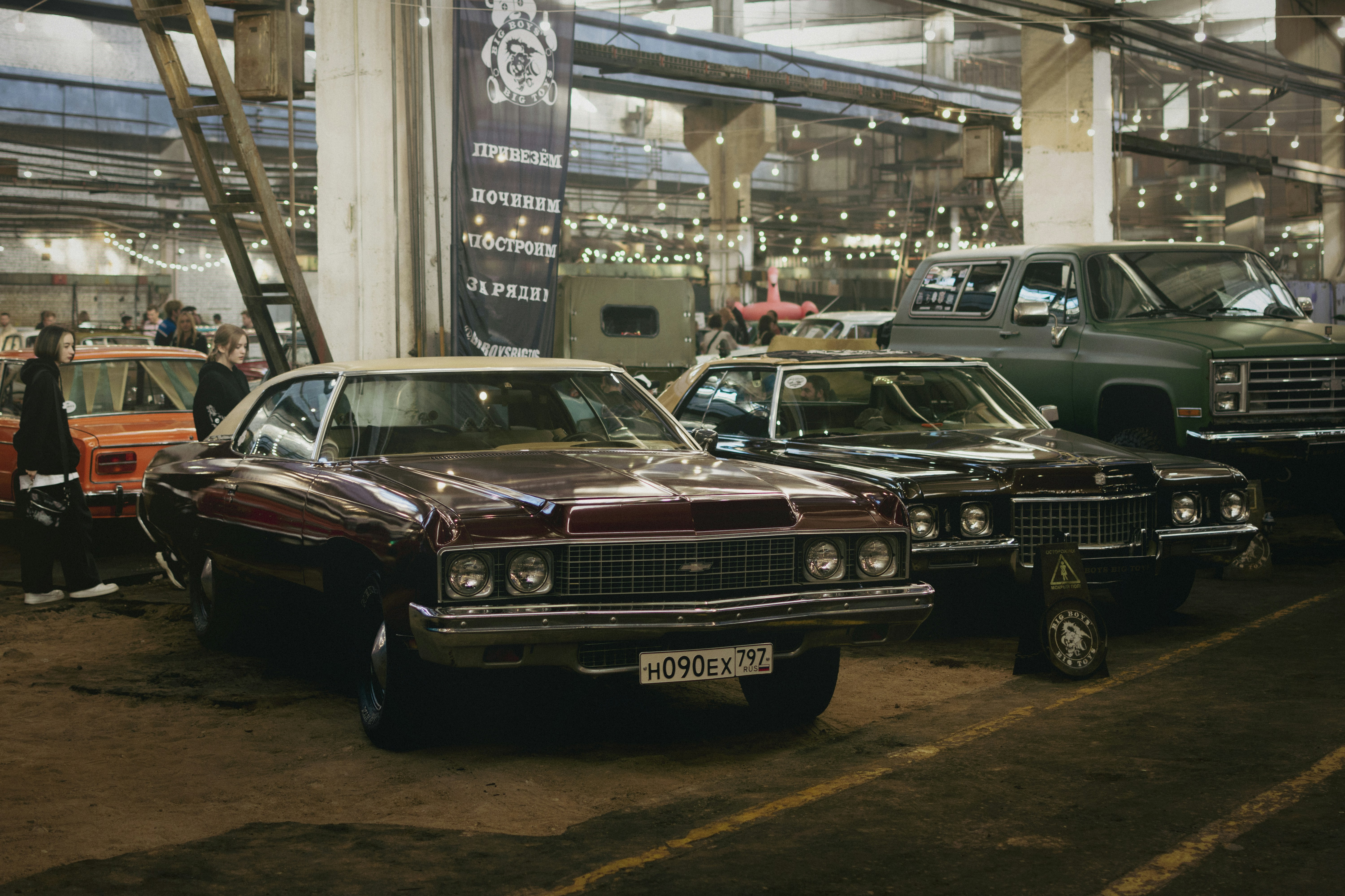 a group of cars parked in a parking lot