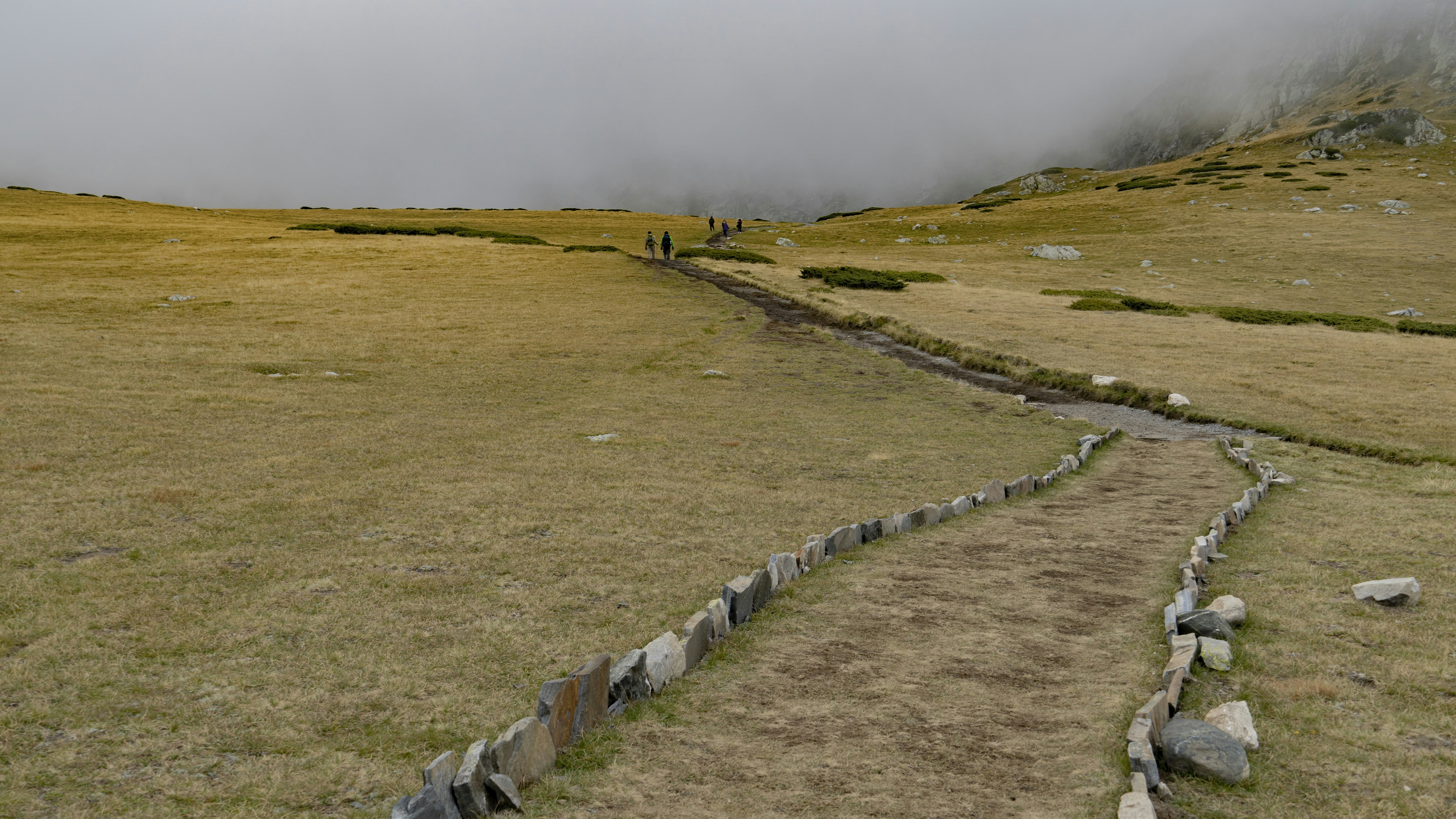 A long road with rocks on the side photo – Free Bulgaria Image on Unsplash