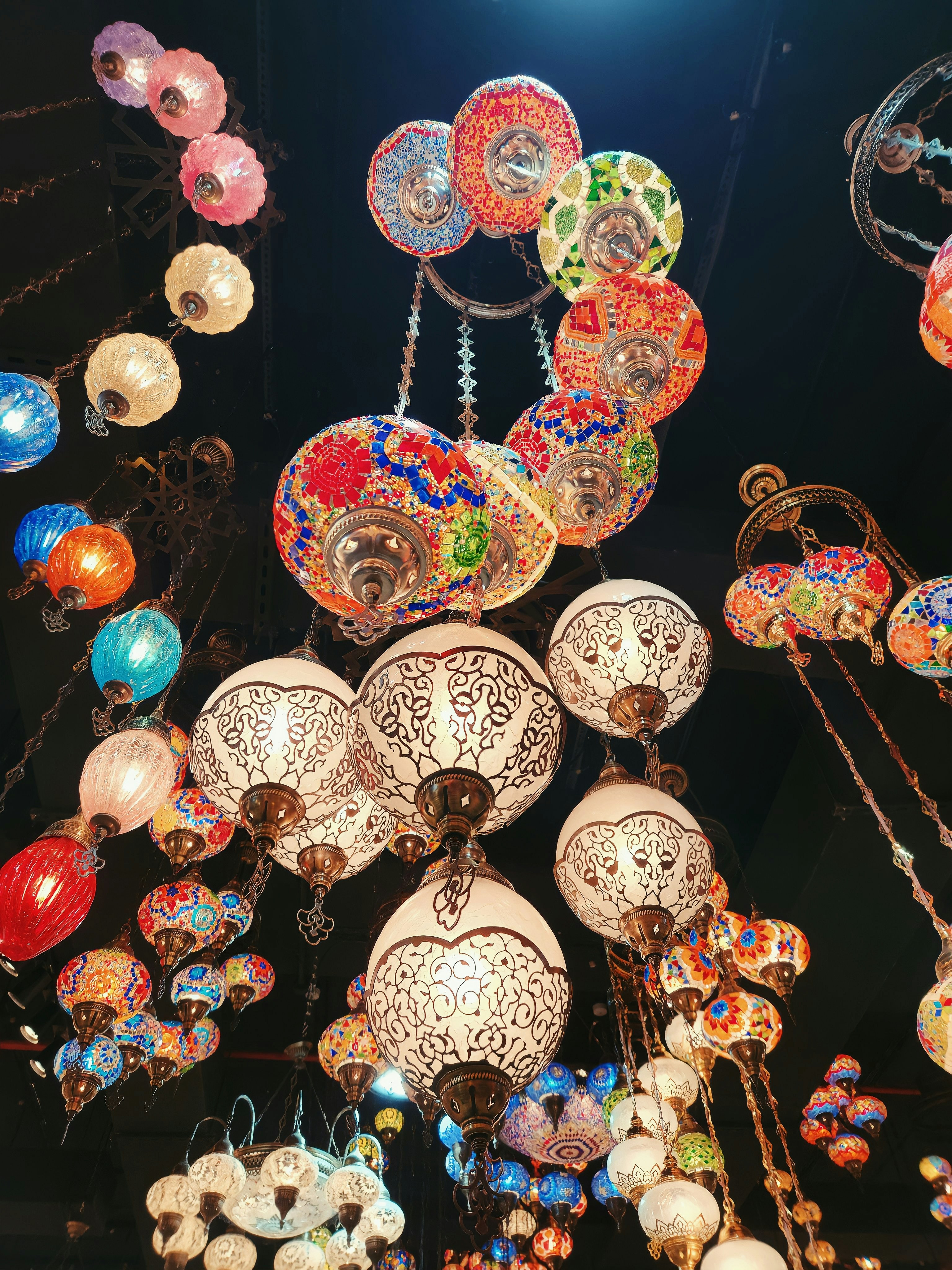 A group of colorfully decorated lamps photo – Free Lamp Image on Unsplash