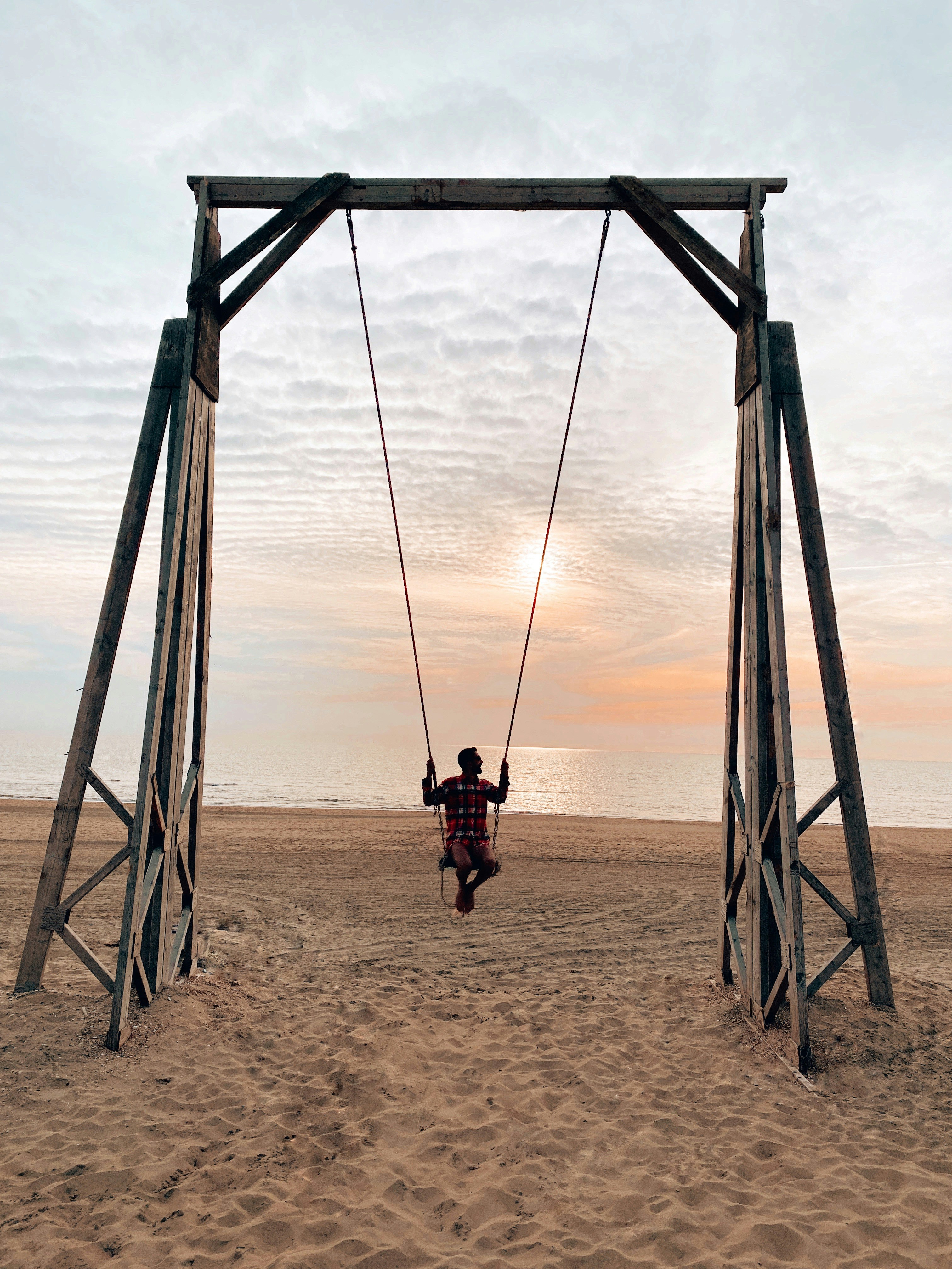 A person on a swing photo – Free Zandvoort Image on Unsplash