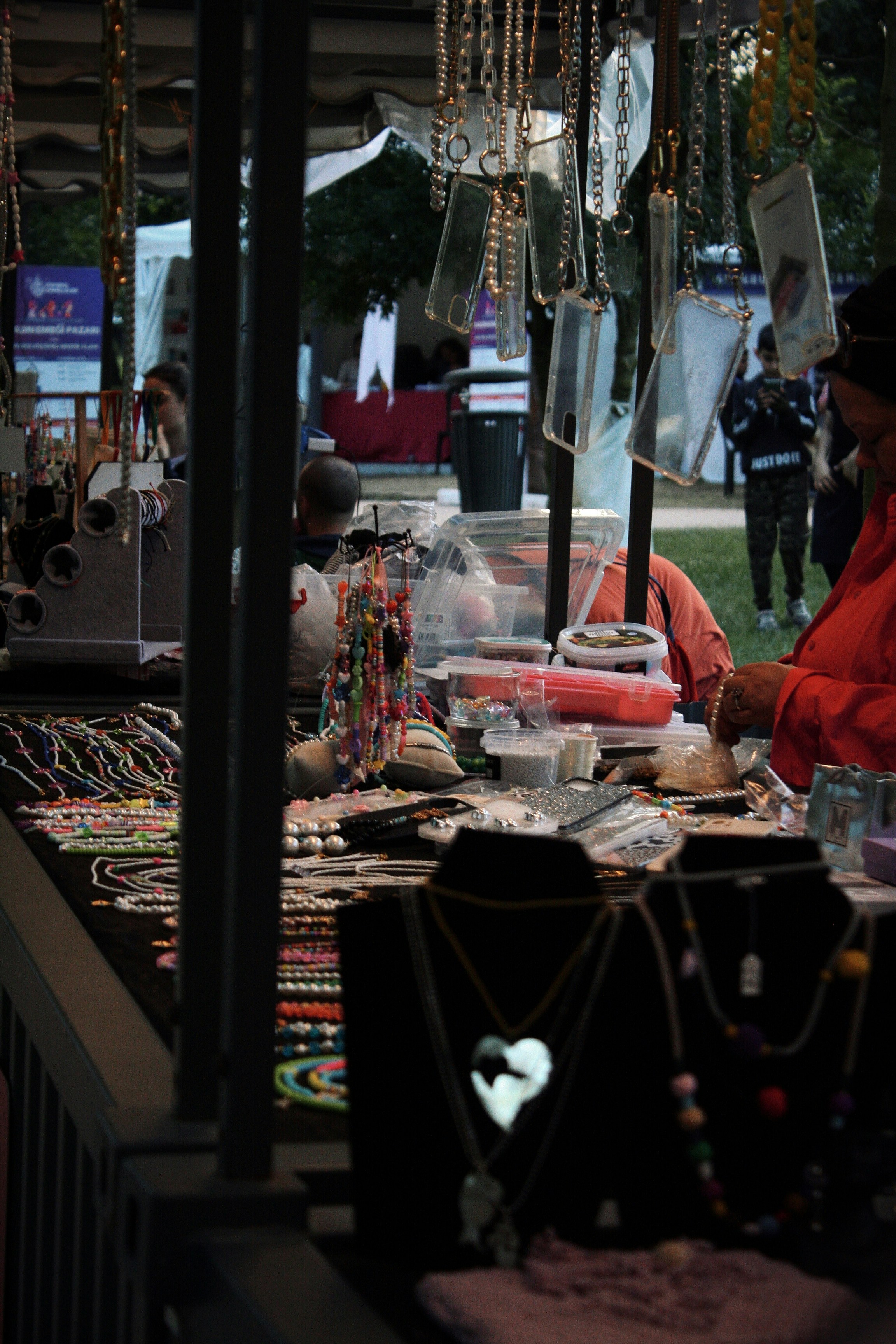Market Stall in Focus: Jewelry and Beads under Dappled Light
