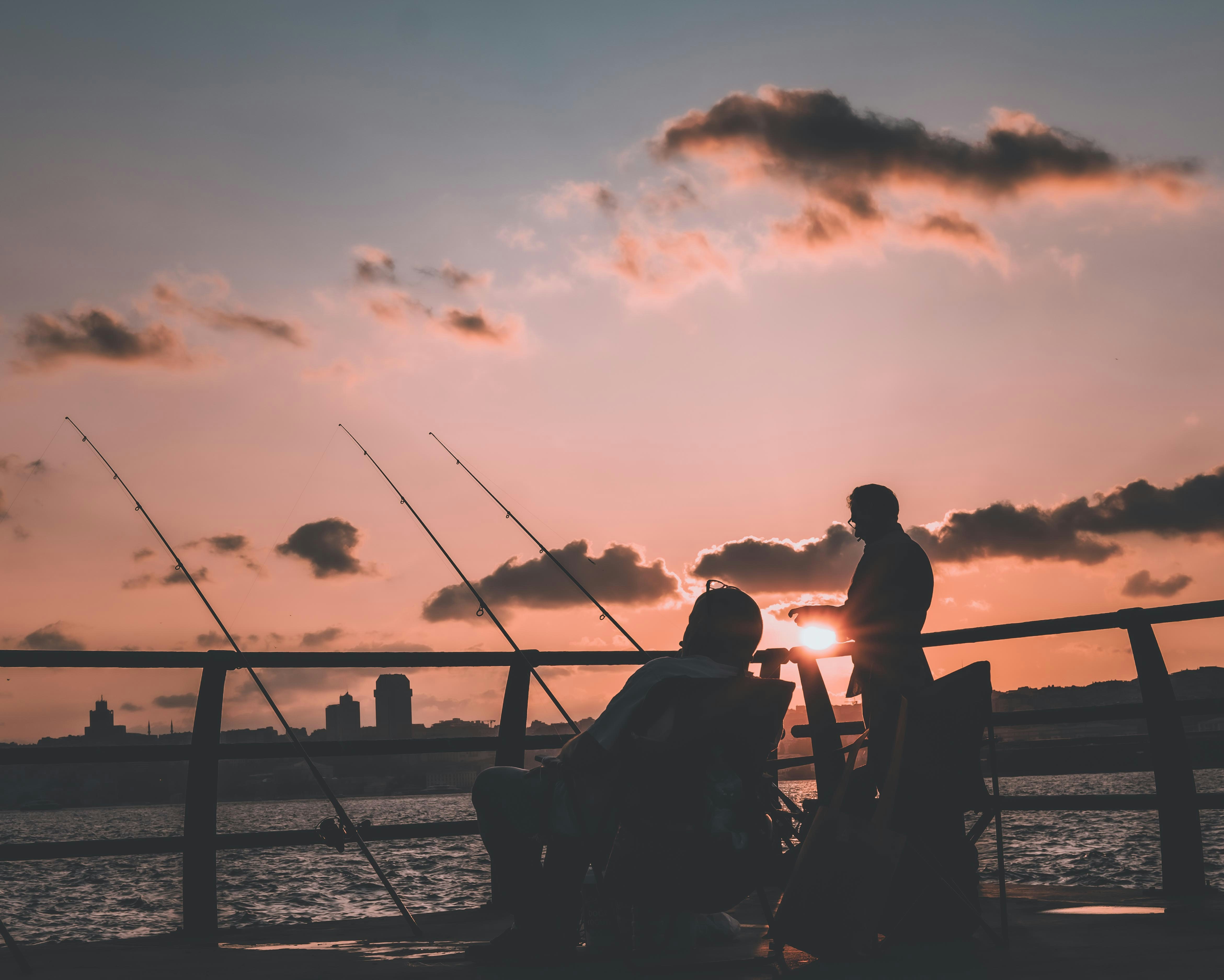 A group of people fishing at sunset photo – Free Outdoors Image on Unsplash