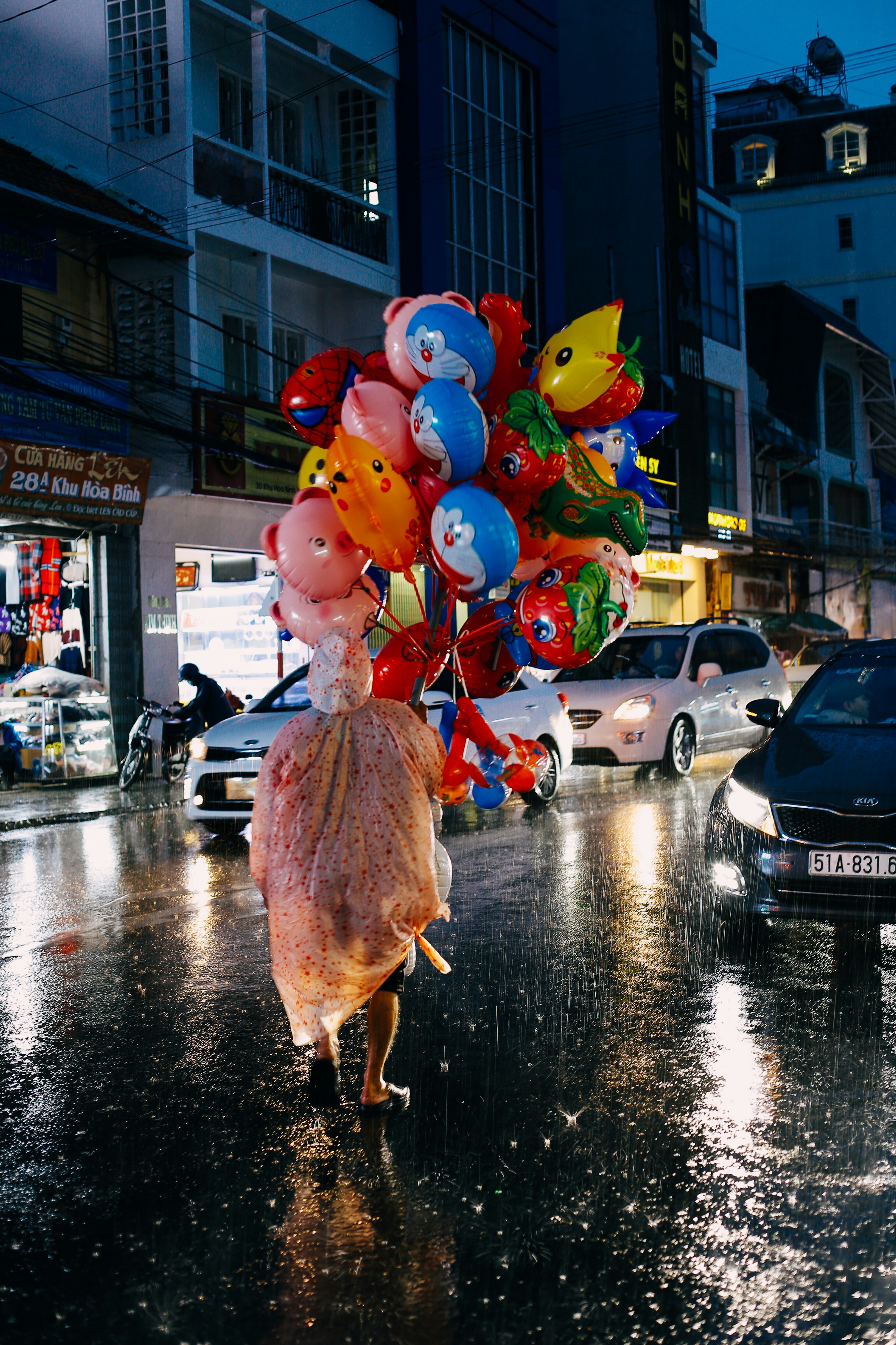 Rainy Street Serenade: Balloon Vendor Navigating the Neon Night