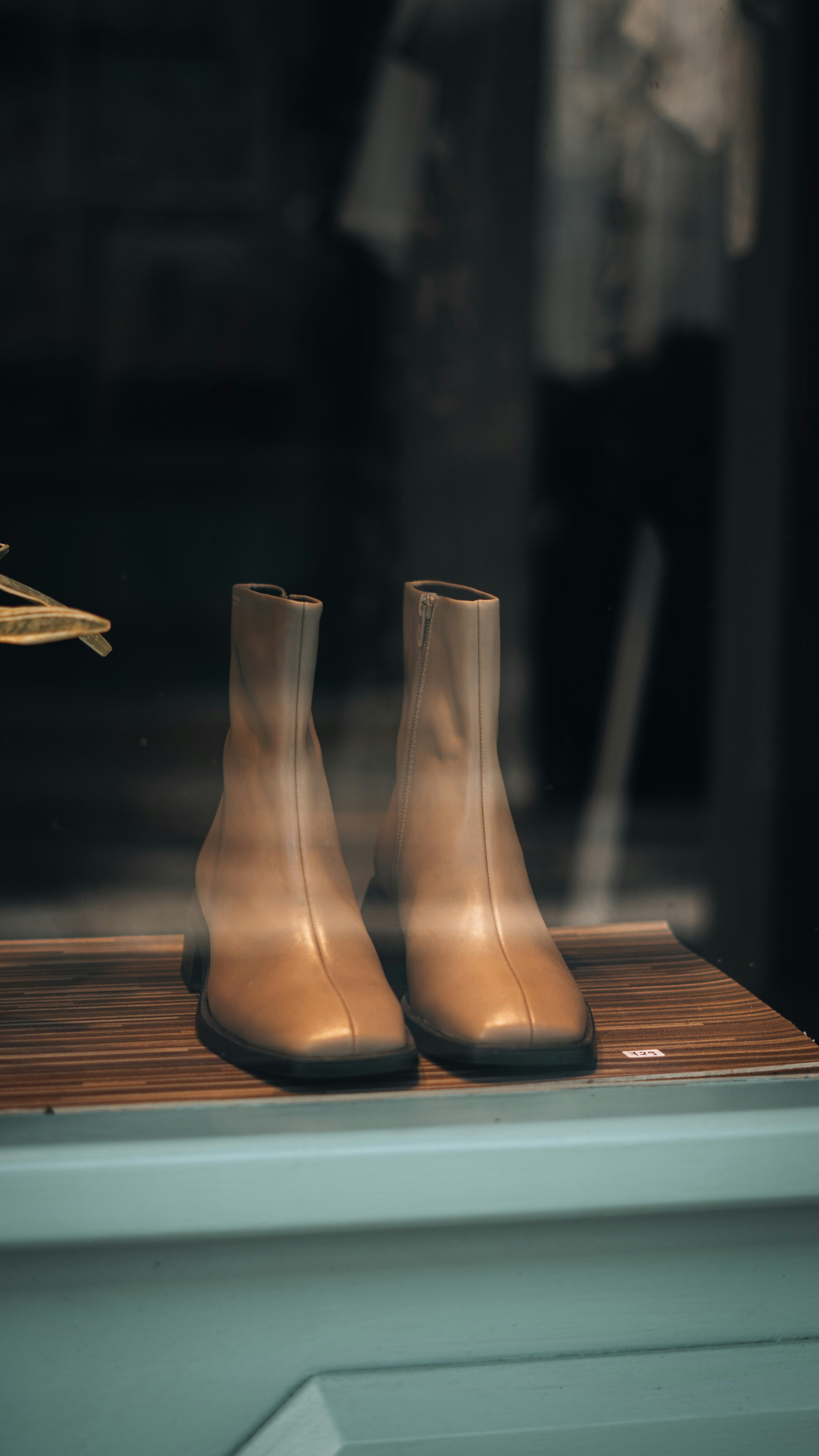A pair of boots on a shelf photo – Free Art Image on Unsplash