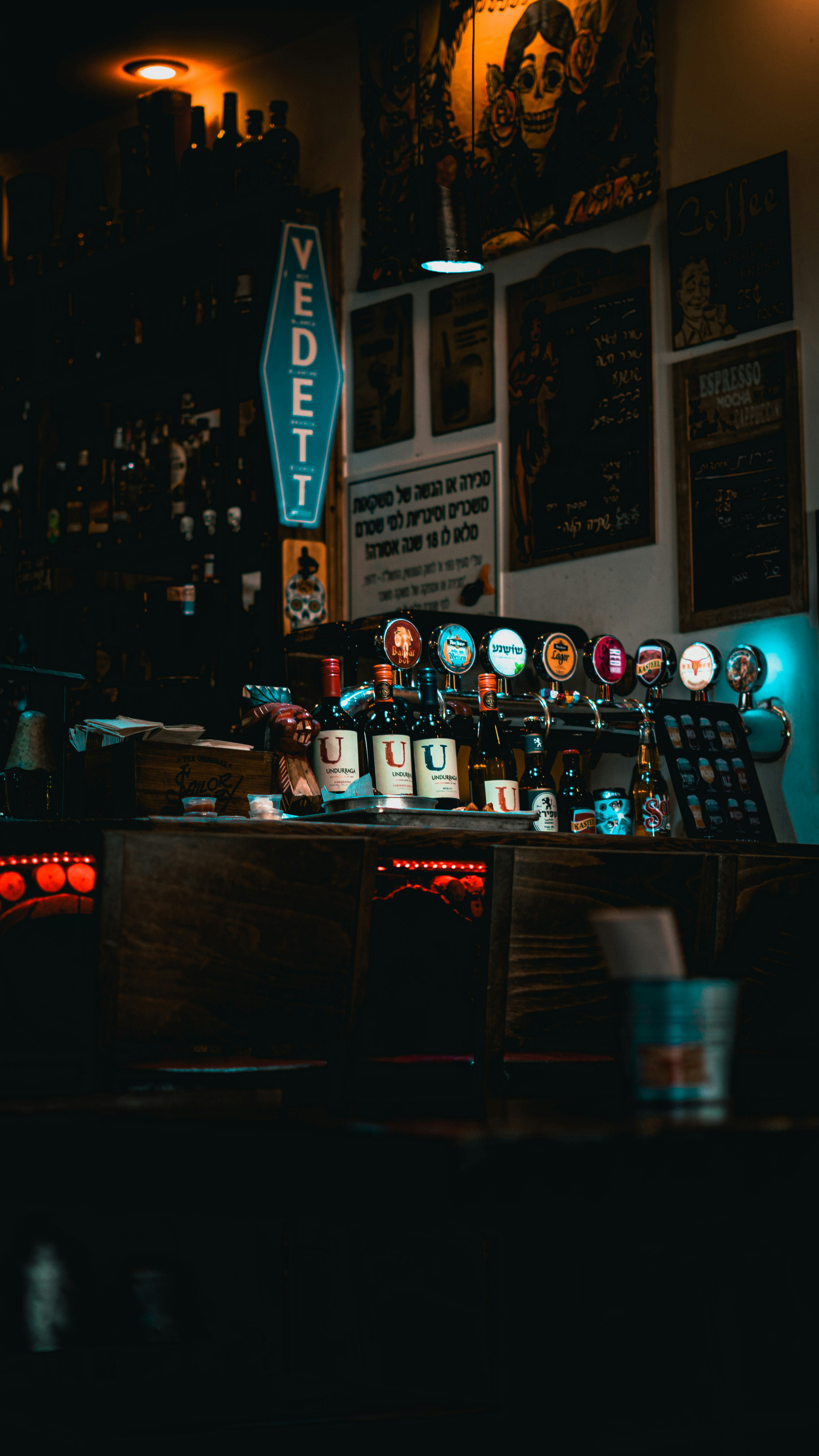 a bar with many bottles of alcohol