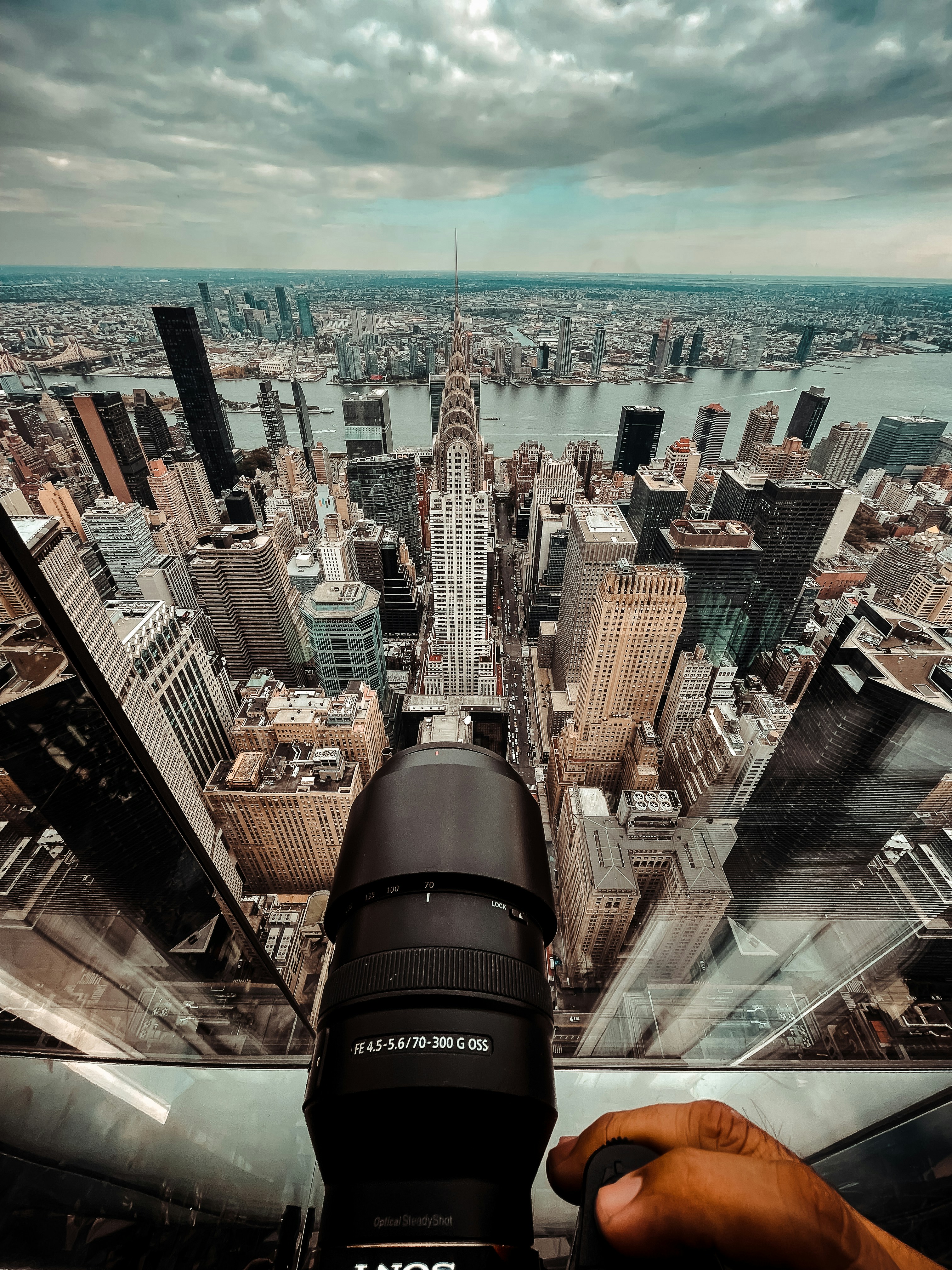 Midtown Needle from the Edge: Chrysler Building Framed by a Glass-Deck Panorama
