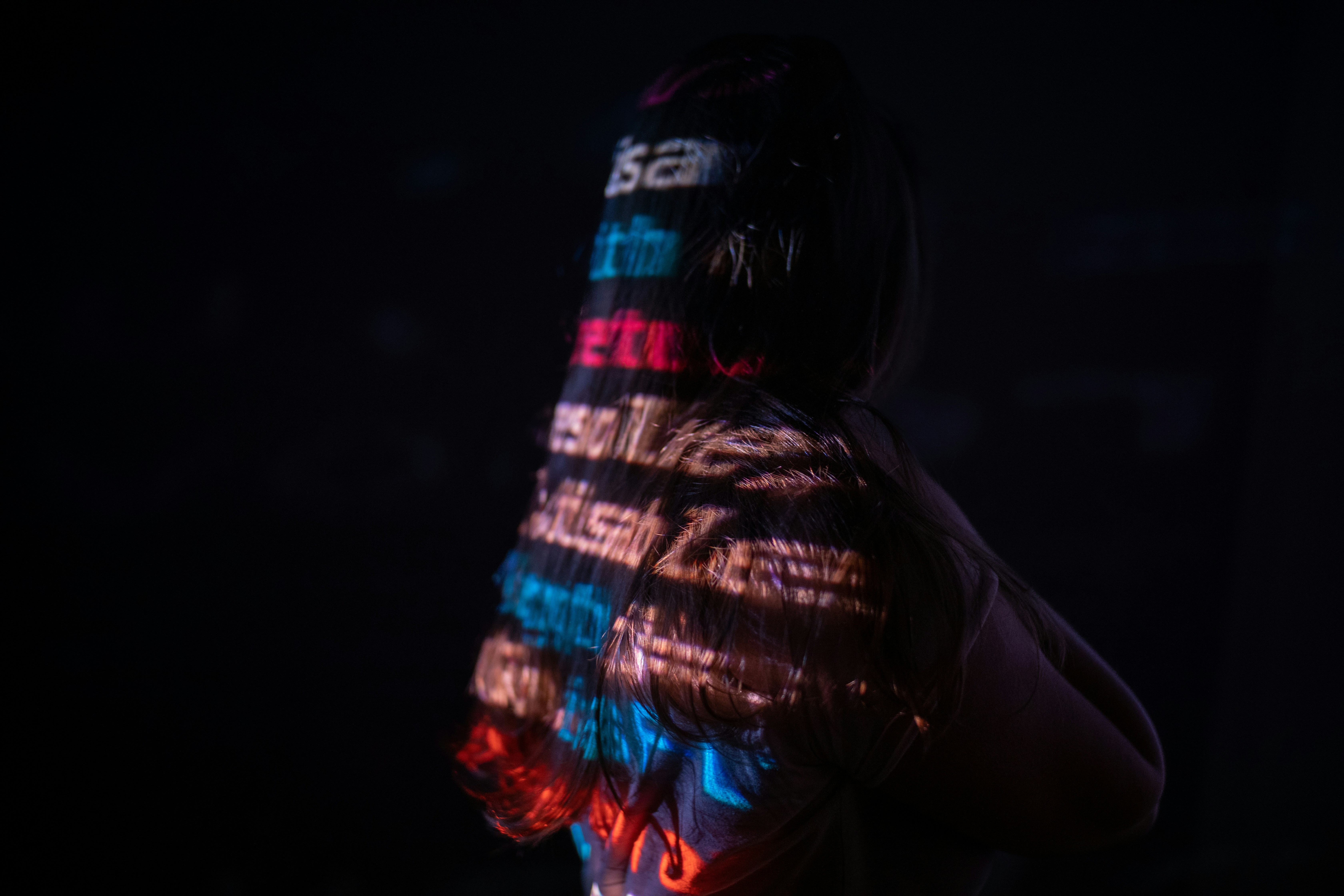 Neon Script Draped Across a Quiet Portrait