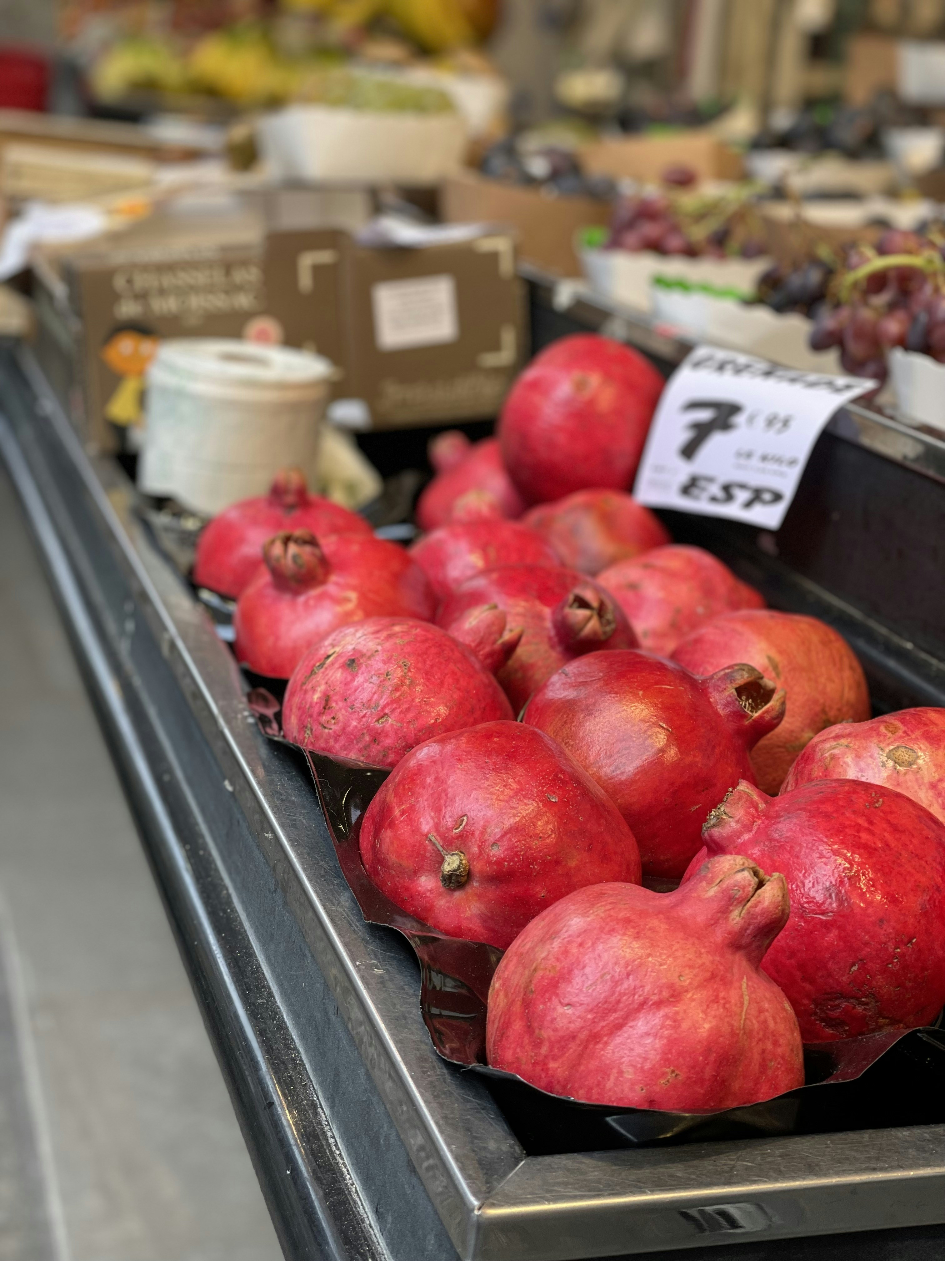Red Pomegranate Bounty at the Market Stand