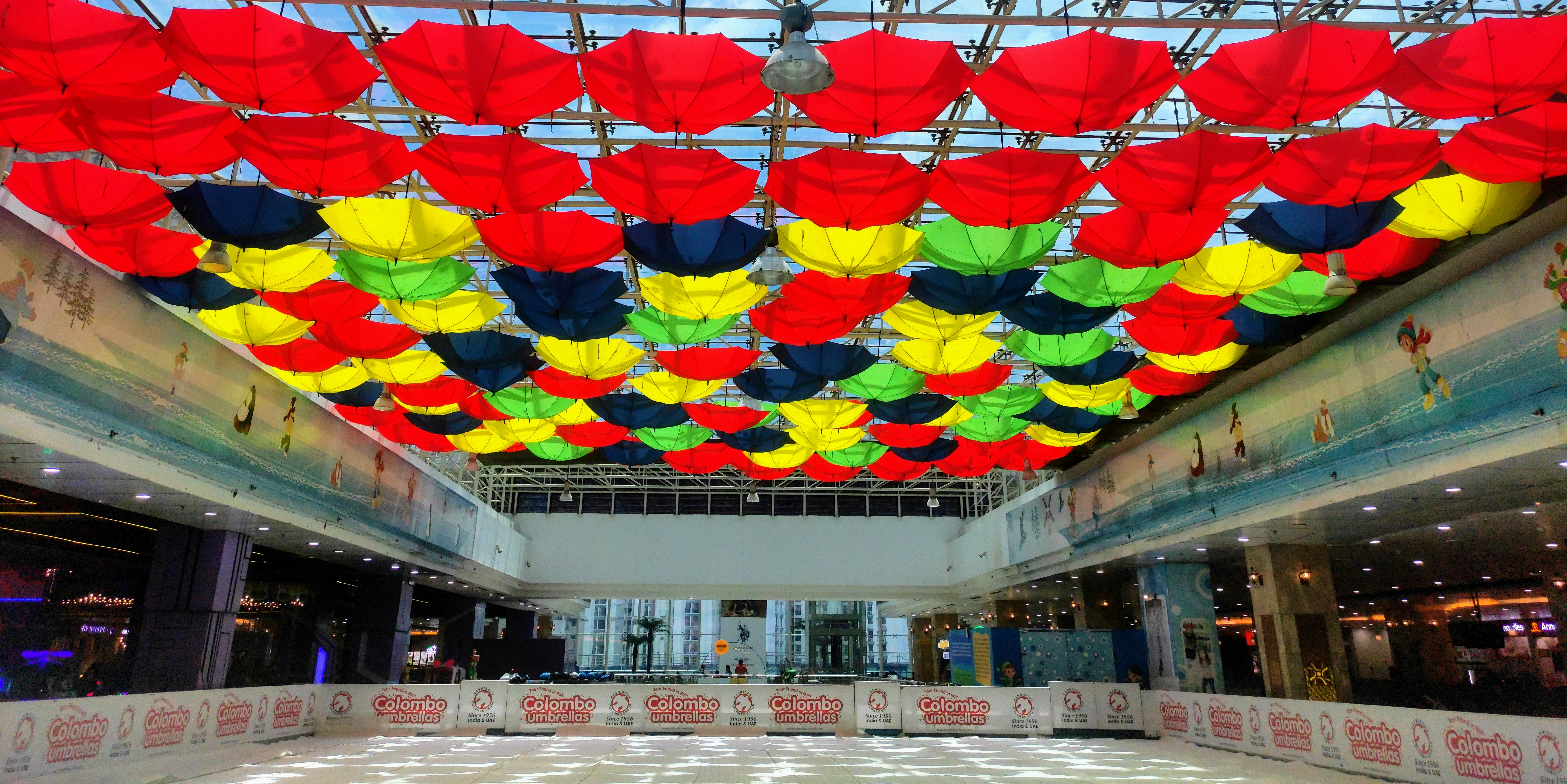 A building with many colorful umbrellas photo – Free Building Image on ...