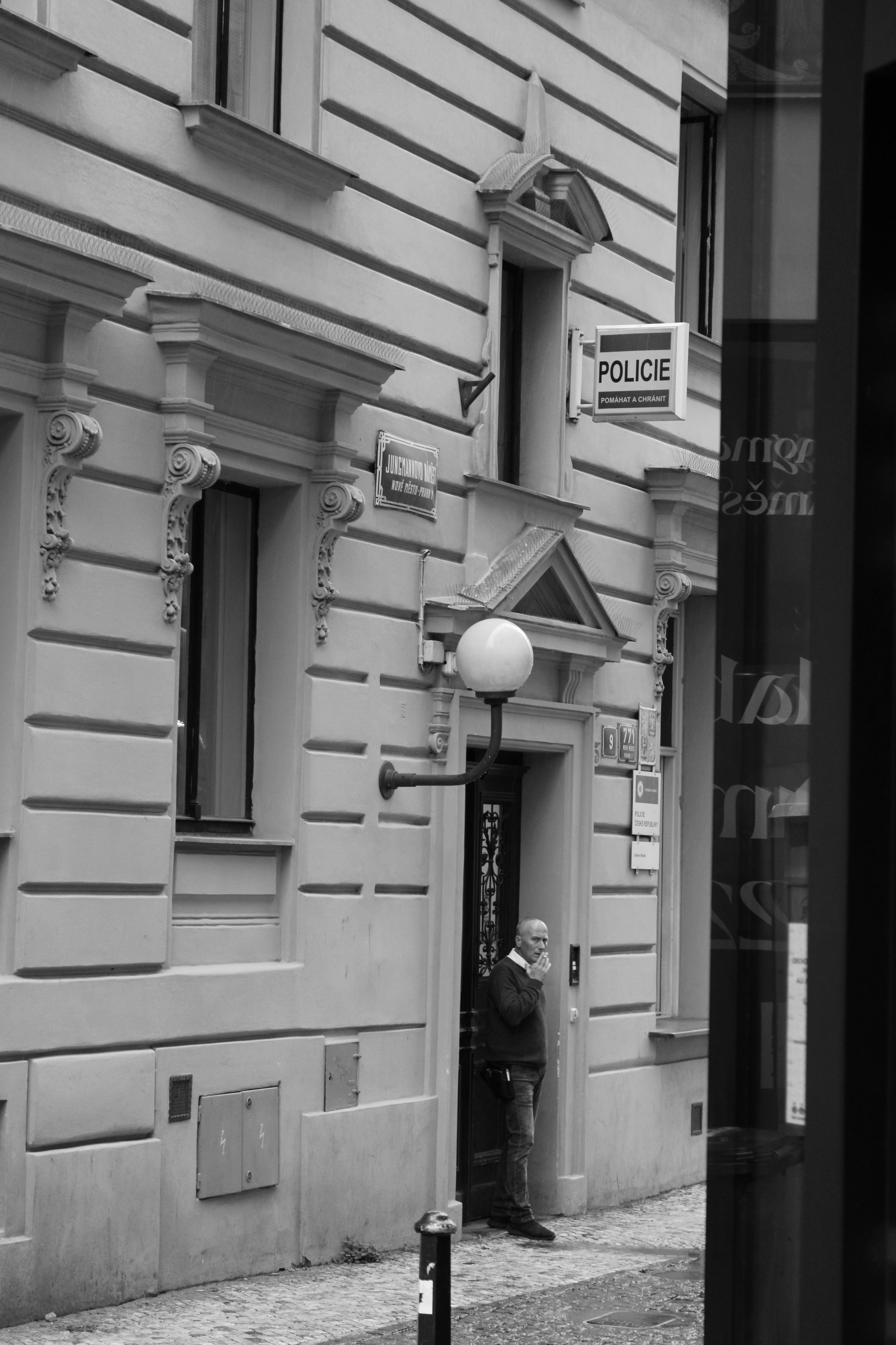 A person standing outside a building photo – Free Human Image on Unsplash