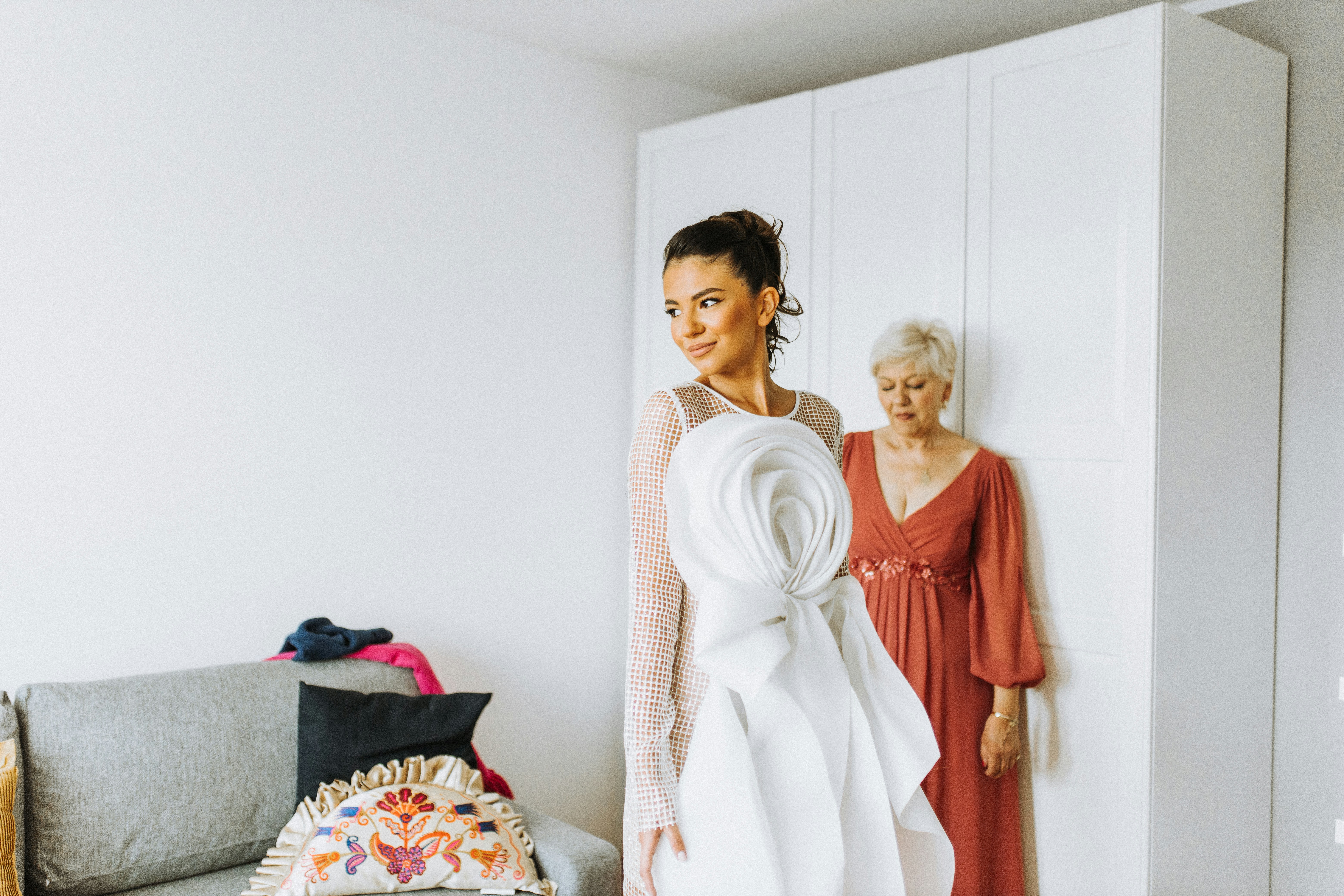 A person in a white dress and a person in a red dress photo – Free ...