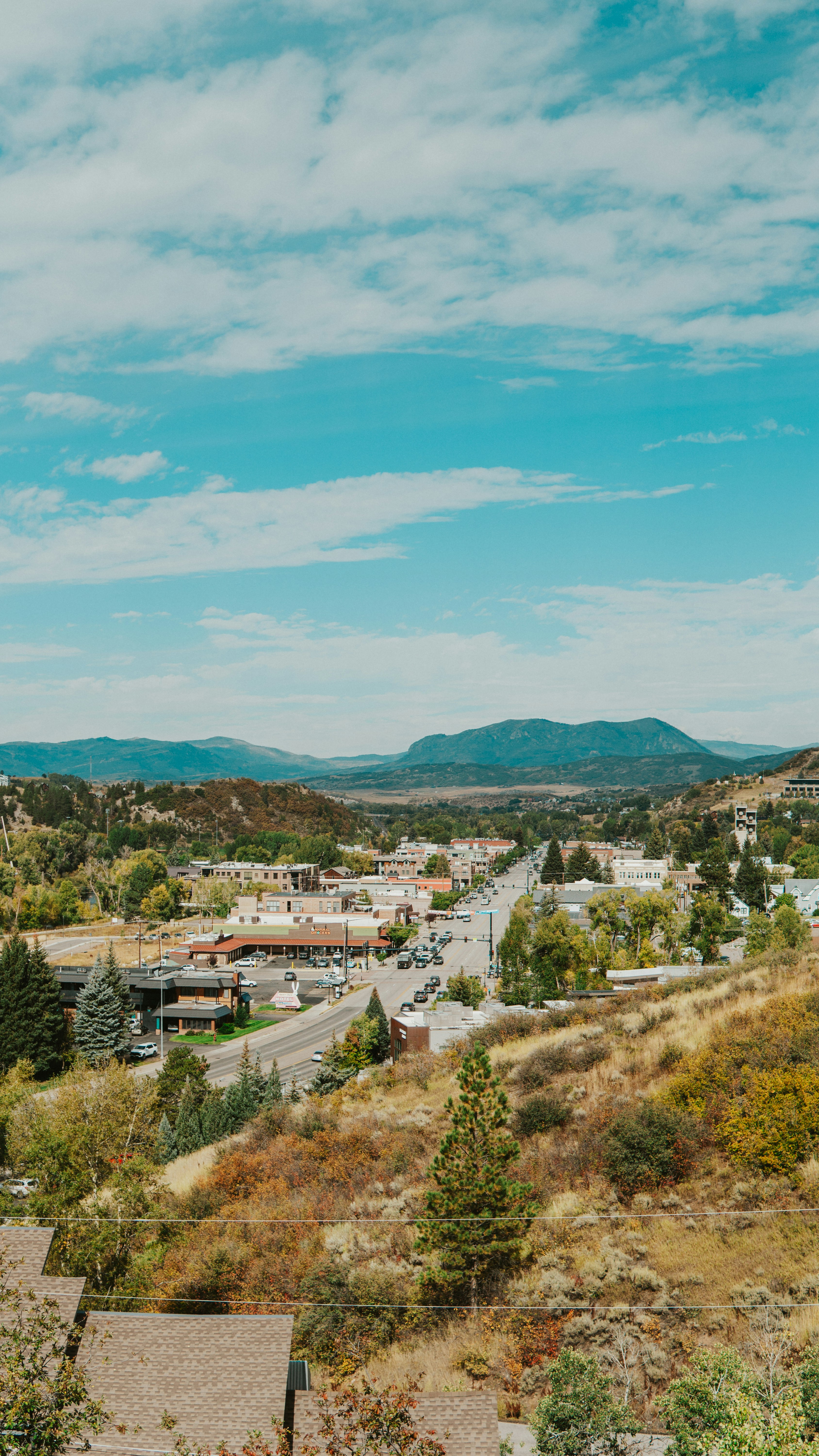 A landscape with trees and buildings photo – Free Colorado Image on ...