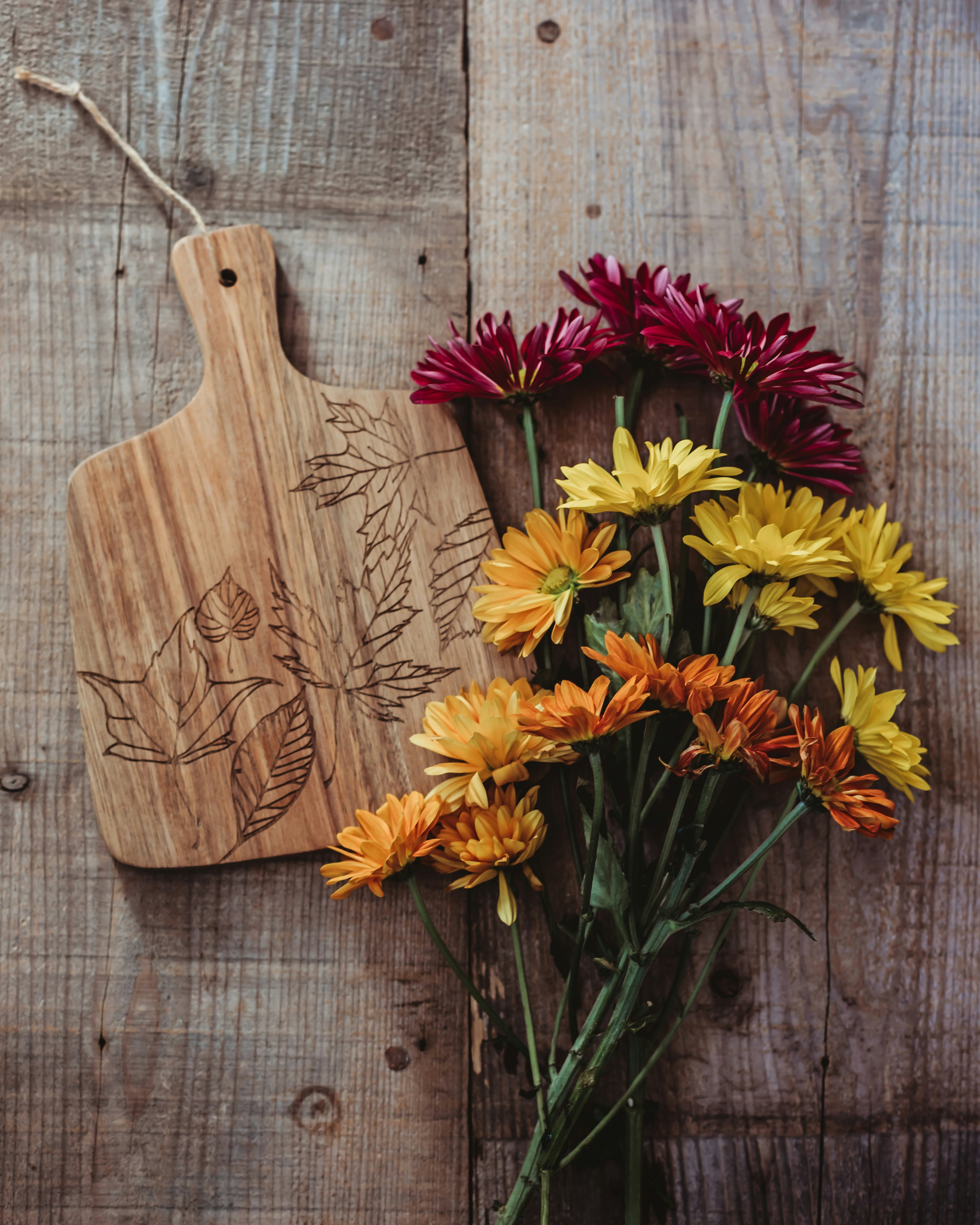 Autumn Bouquet and a Leaf-Carved Board: Rustic Colorplay on Weathered Wood