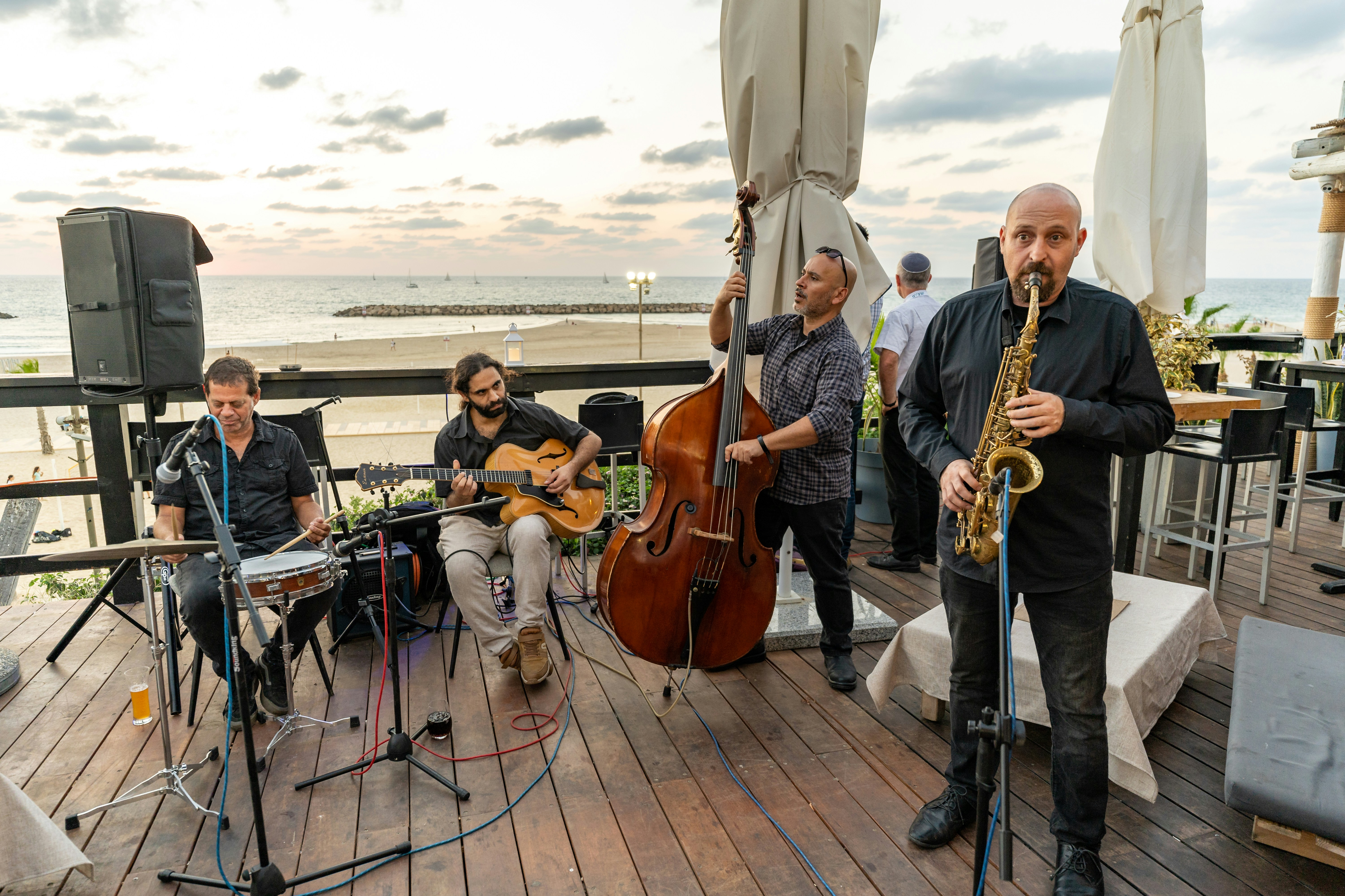 Sunset Serenade on the Deck: A Jazz Quartet with a Brass Saxophonist